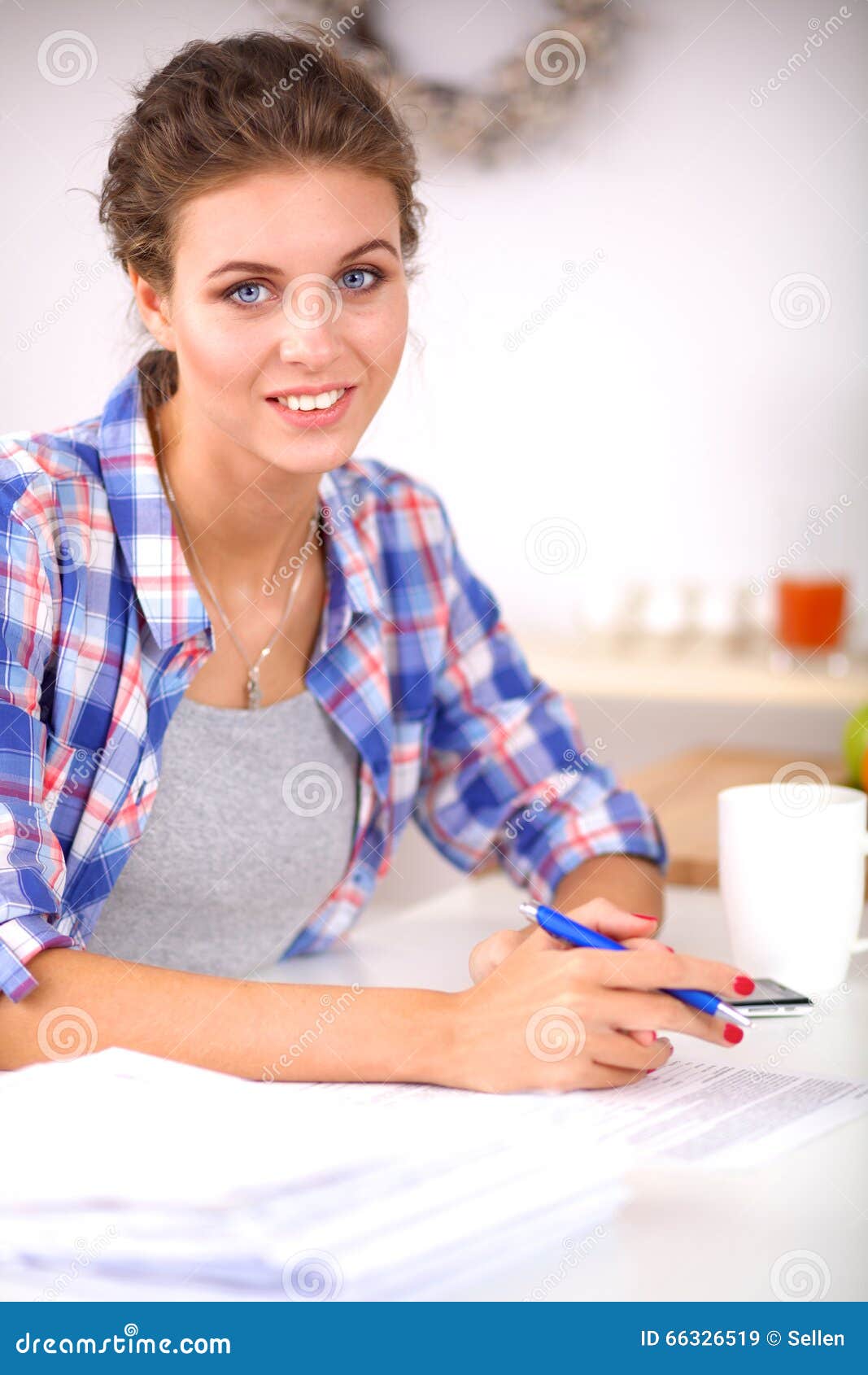 Beautiful Young Woman Writing Something in Her Note Pad Stock Image ...