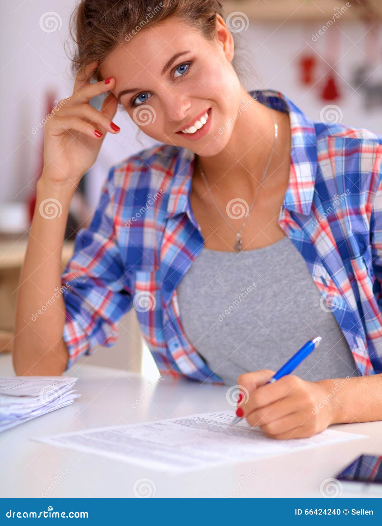 Beautiful Young Woman Writing Something in Her Note Pad Stock Photo ...