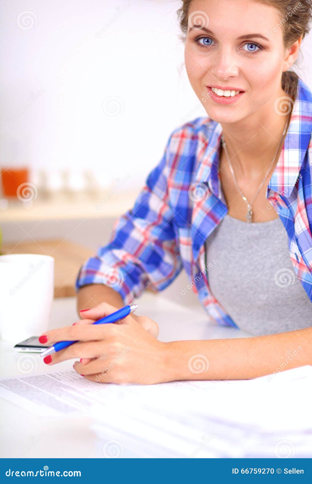 Beautiful Young Woman Writing Something in Her Note Pad Stock Photo ...