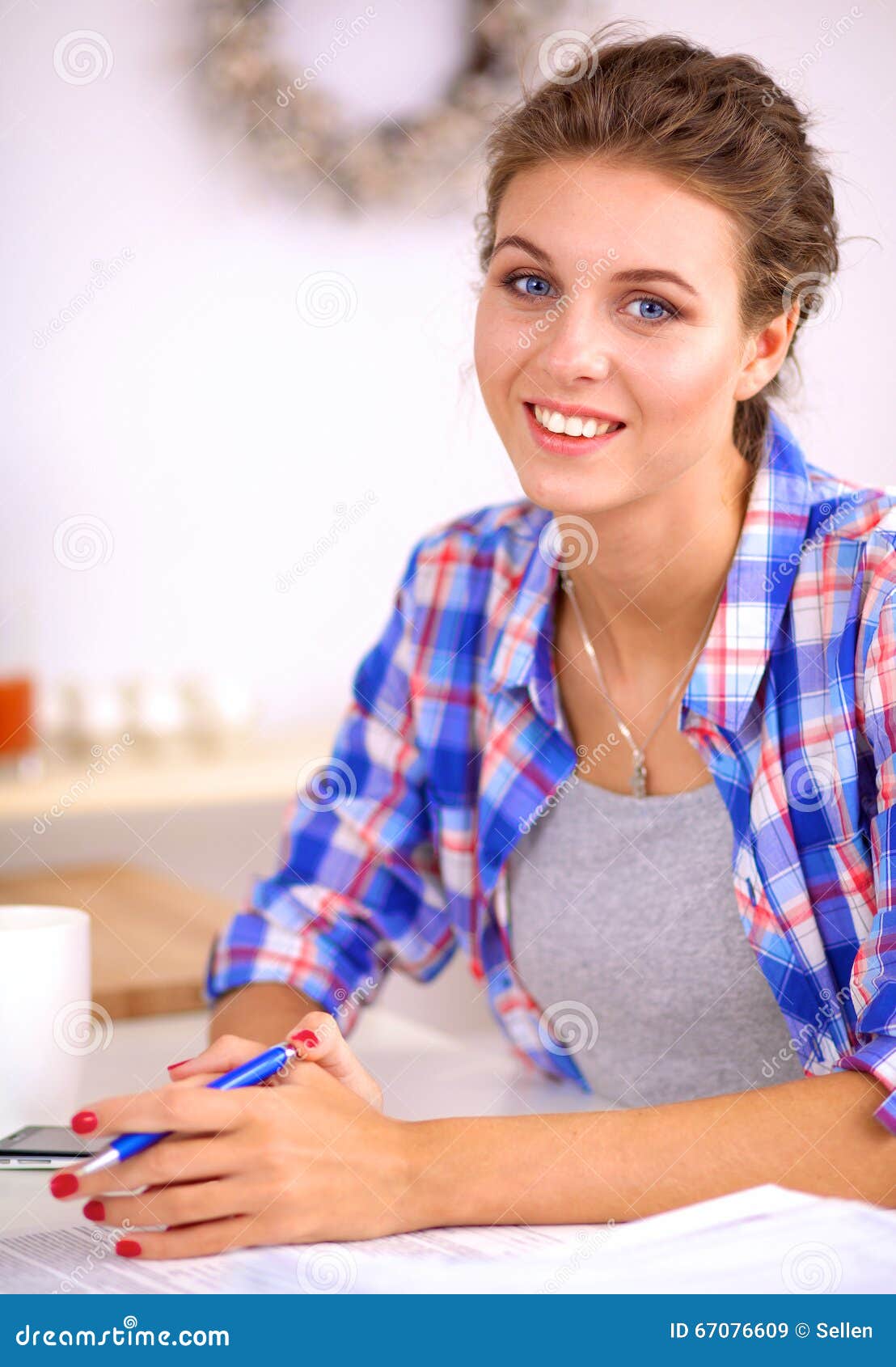 Beautiful Young Woman Writing Something in Her Note Pad Stock Image ...