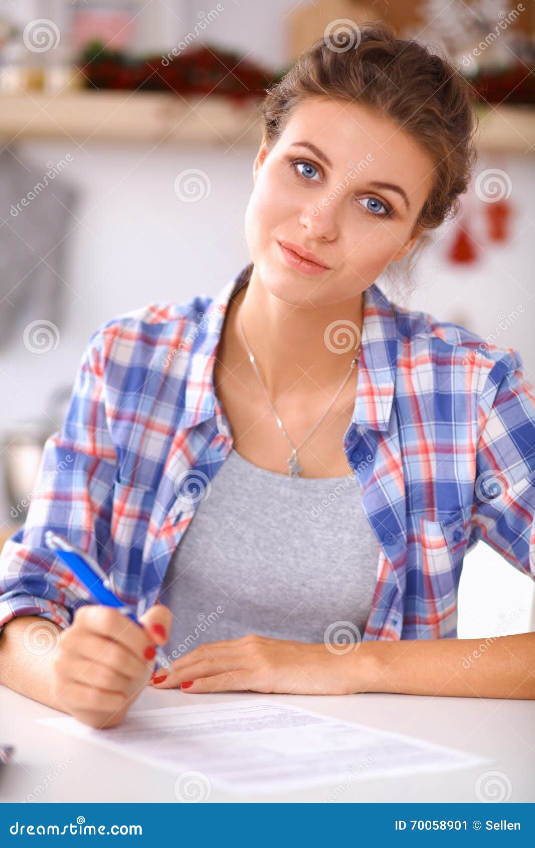 Beautiful Young Woman Writing Something in Her Note Pad Stock Image ...