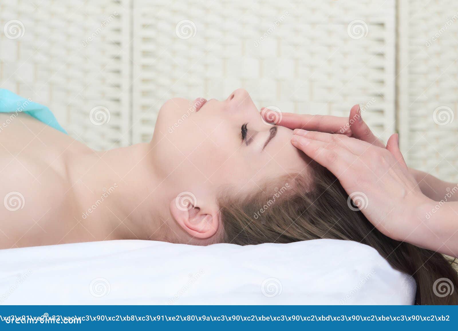 Beautiful Young Woman Getting Facial Massage In The Spa Salon Close Up