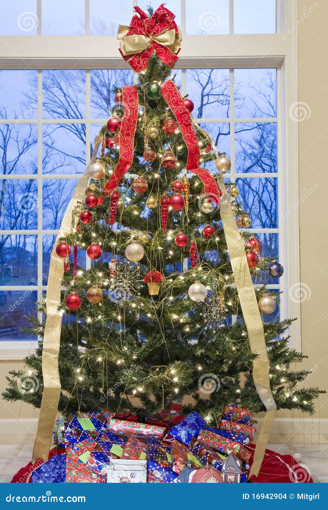 Beautifully Decorated Christmas Tree by a Window Stock Photo - Image of ...