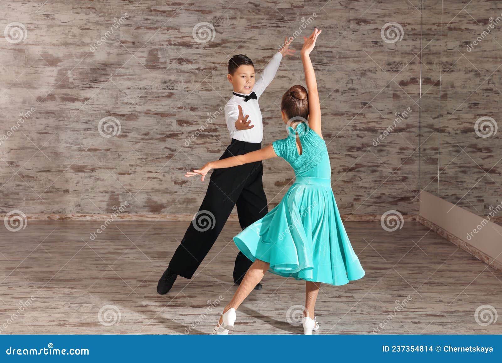 Beautifully Dressed Couple of Kids Dancing Together in Studio Stock ...