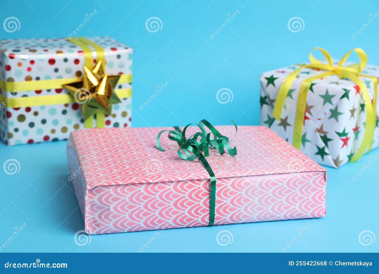 Beautifully Wrapped Gift Boxes on Light Blue Background Stock Photo ...