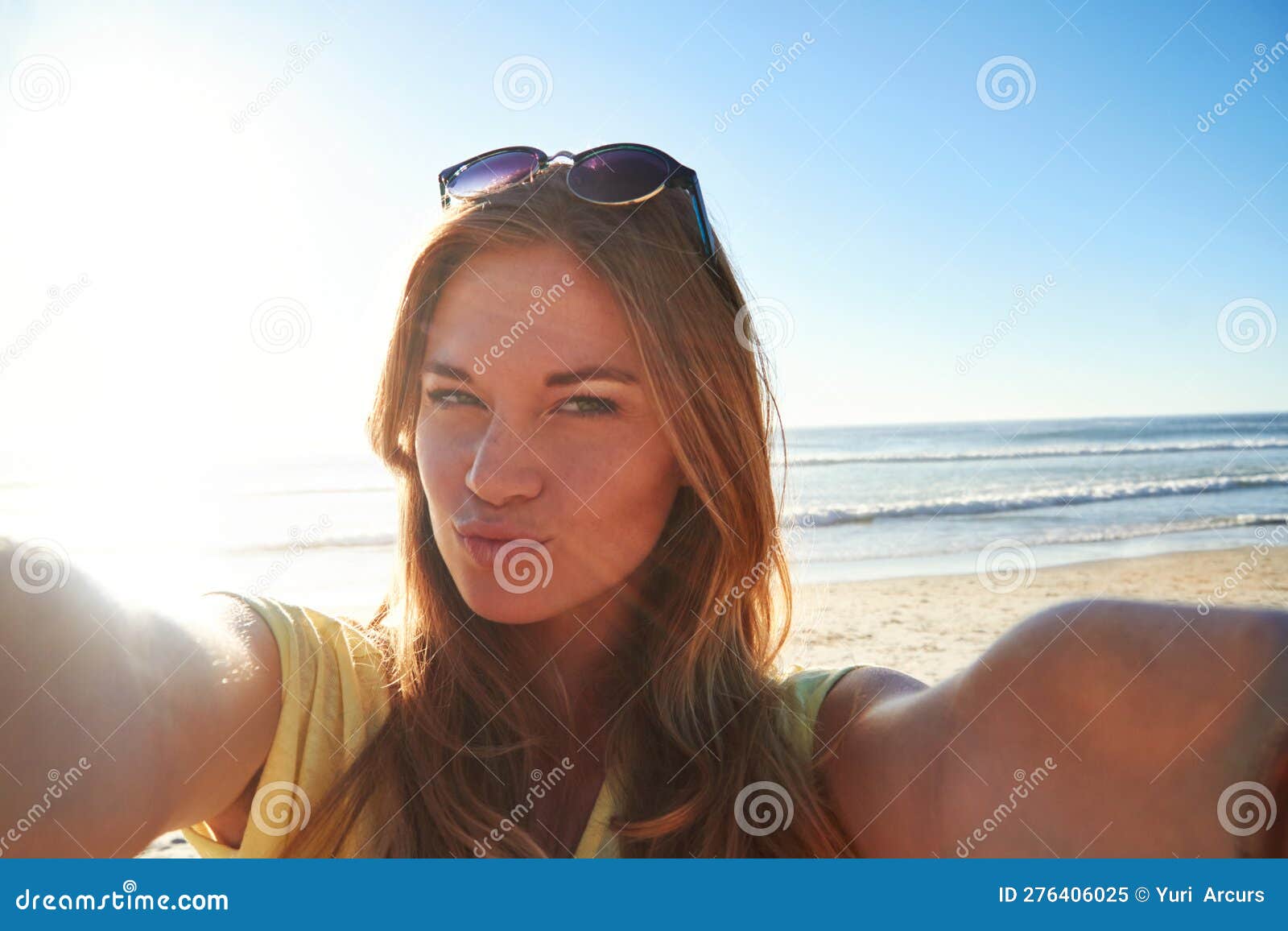 Beauty On The Beach An Attractive Young Woman Taking A Selfie On The
