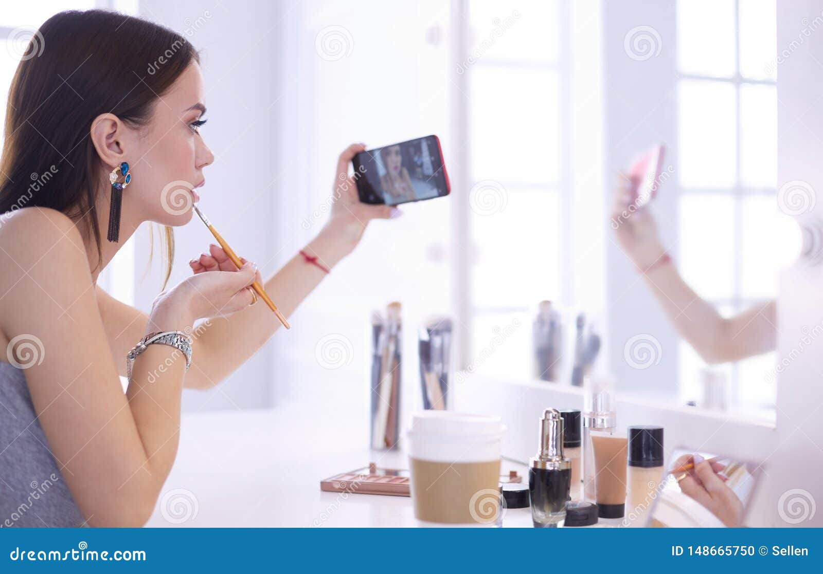 Beauty Blogger Filming Makeup Tutorial with Smartphone in Front of ...
