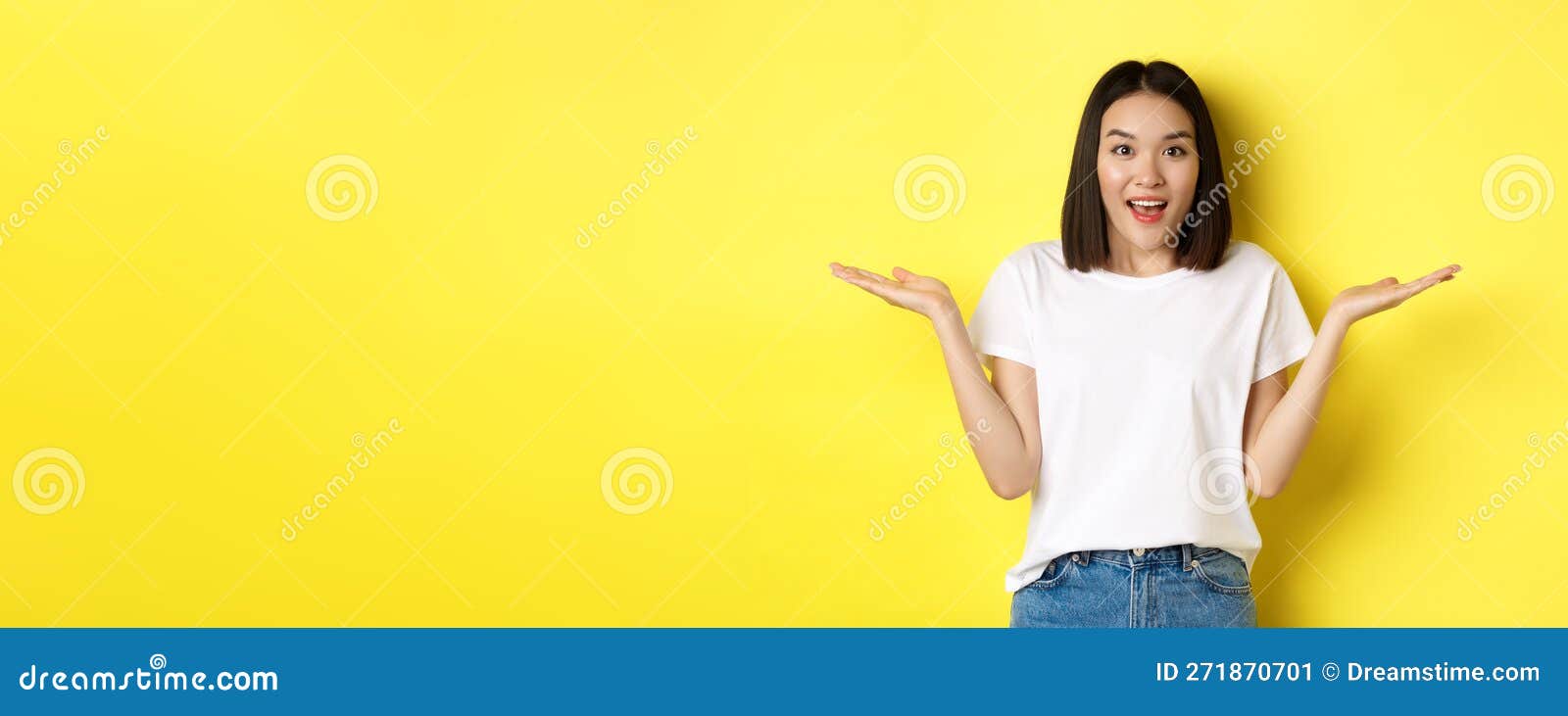 Beauty And Fashion Concept Surprised Asian Girl Spread Hands Sideways Holding On Palms