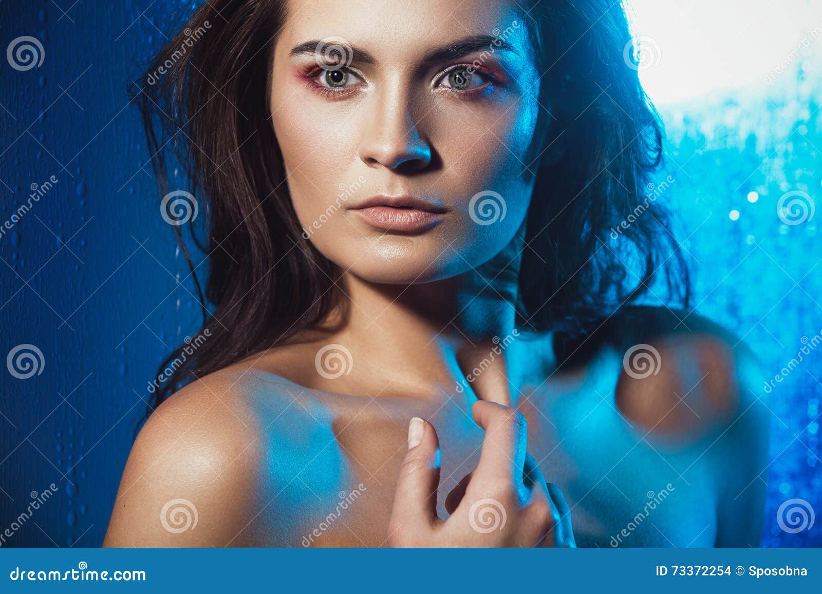 Beauty Portrait Of Beautiful Female Model On A Blue Background Stock