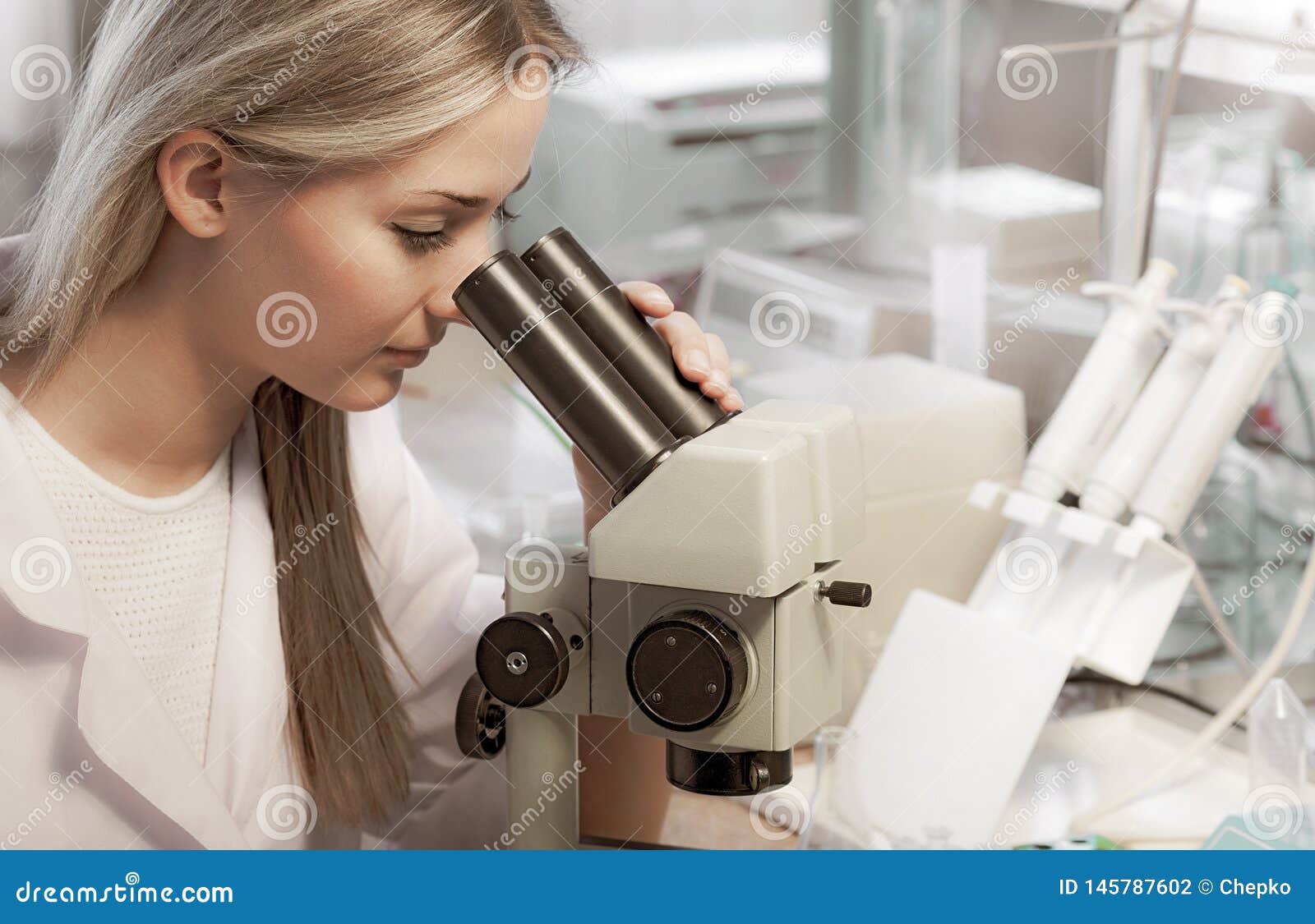 Beauty Scientist Looks in Microscope in Chemical Laboratory Stock Photo ...