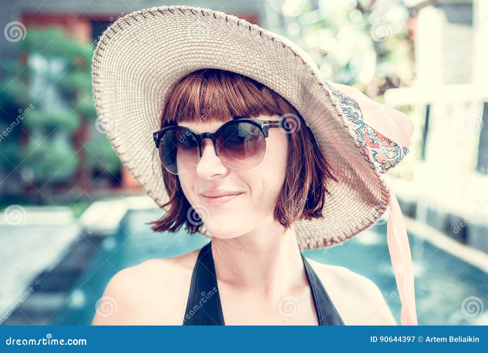 Beauty Woman With Hat And Sunglasses Enjoying Her Summer Vacation At