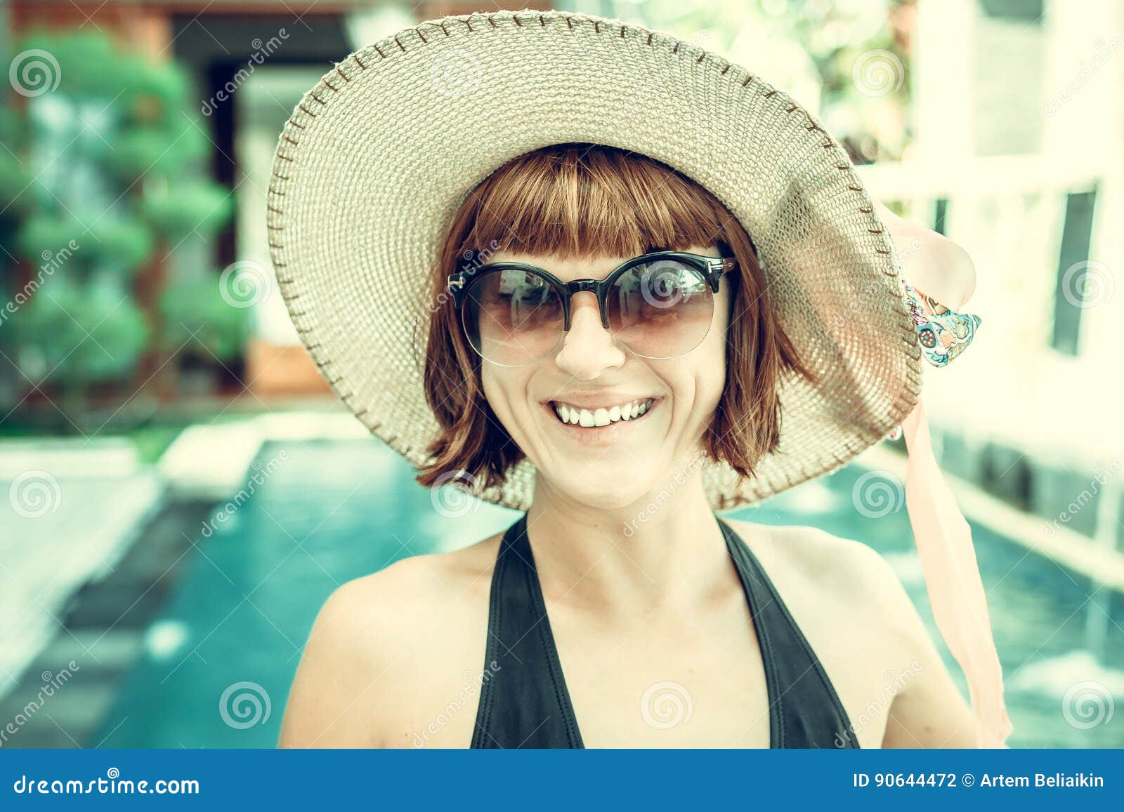 Beauty Woman With Hat And Sunglasses Enjoying Her Summer Vacation At