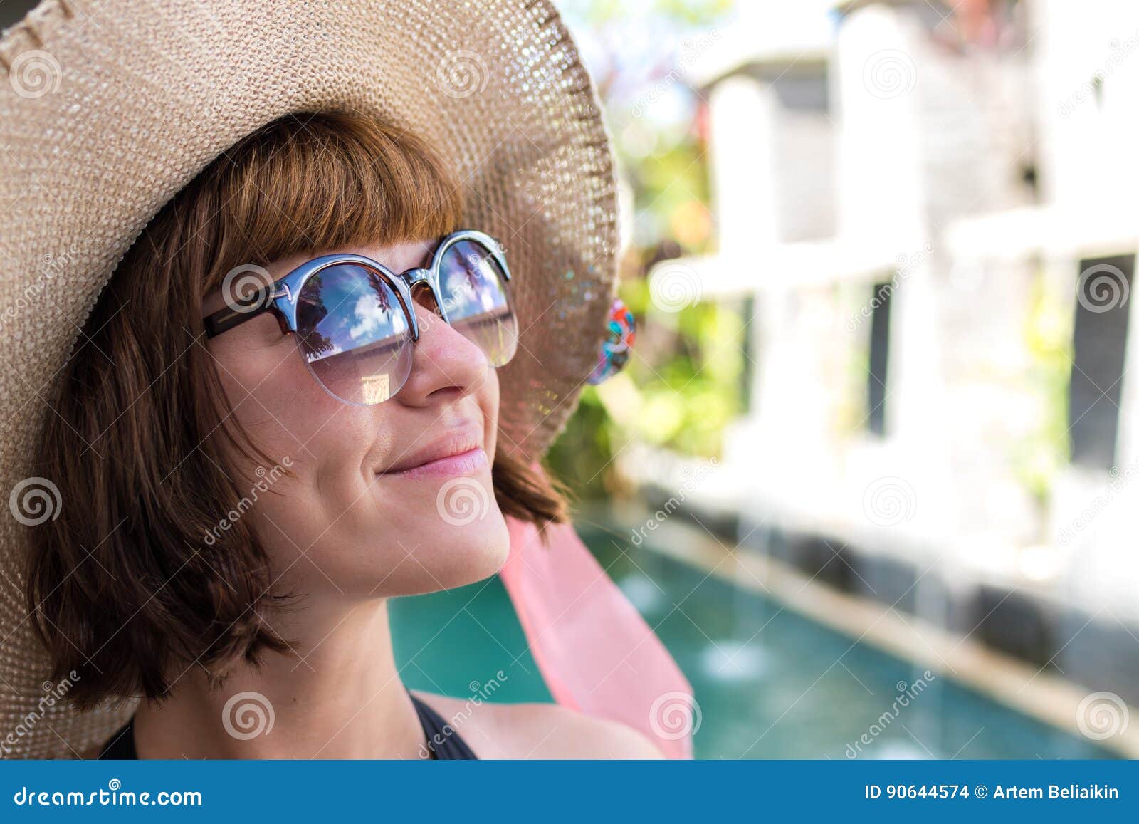 Beauty Woman With Hat And Sunglasses Enjoying Her Summer Vacation At