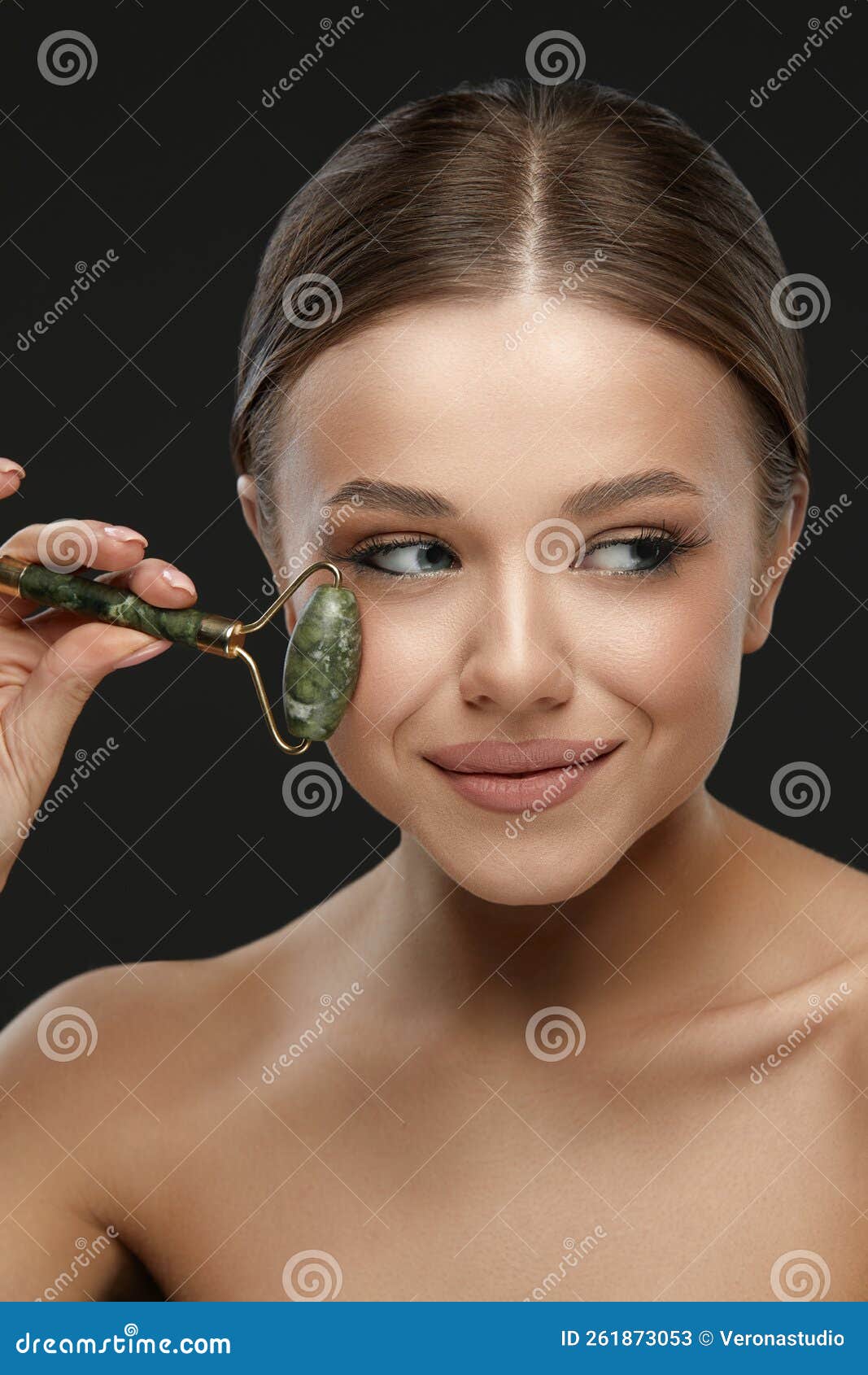 Beauty Skin Care Face Massage Woman Using Jade Facial Roller For Face