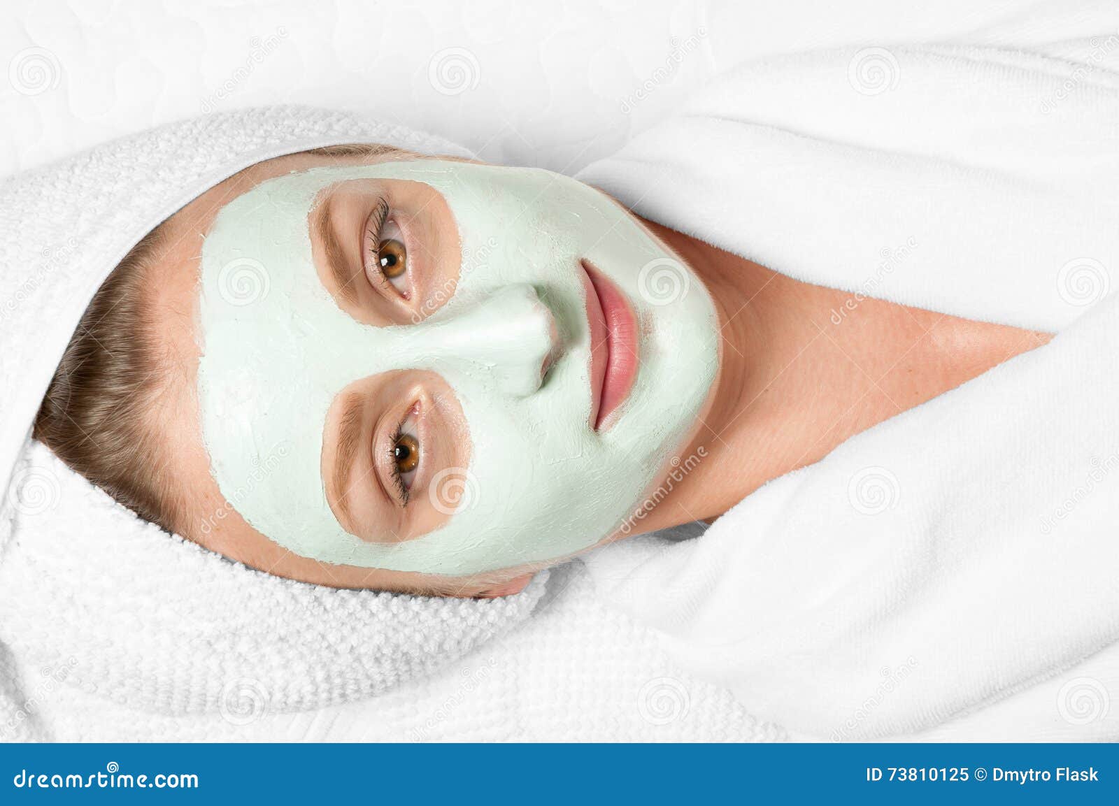 Beauty Treatments Woman Applying Facial Mask At Spa Stock Image