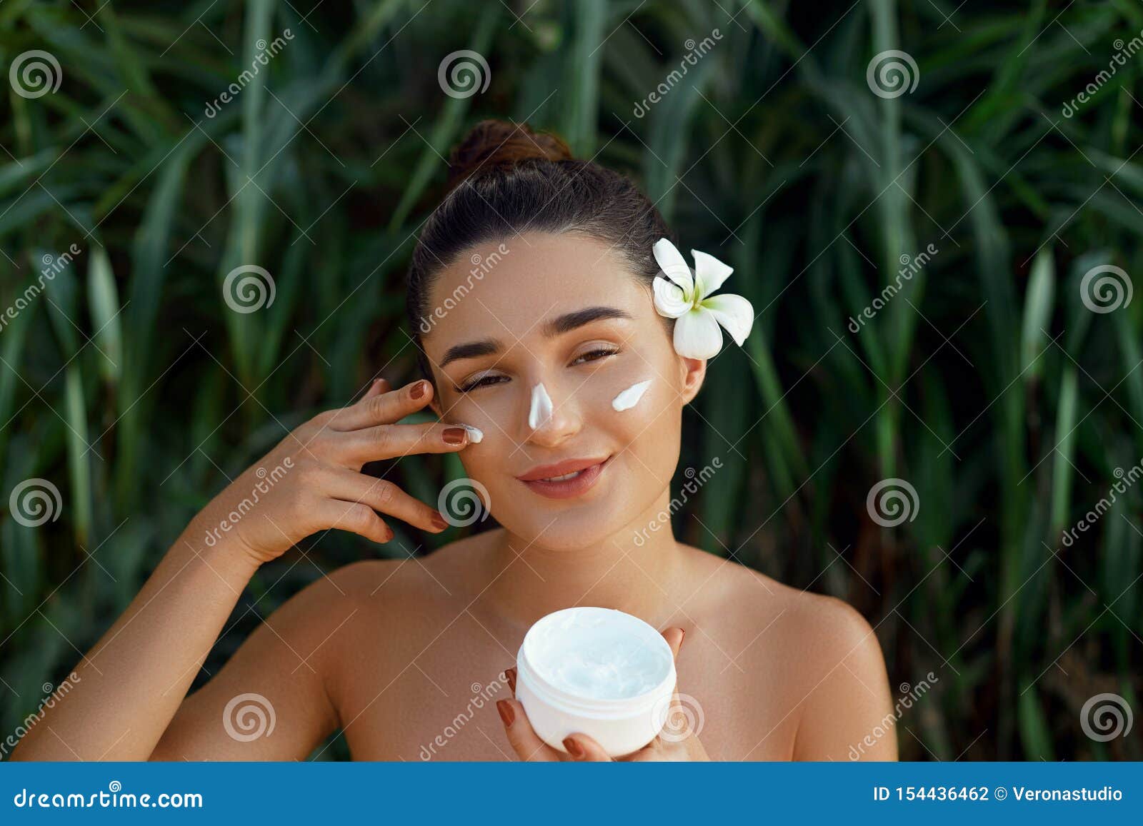 Beauty Woman Concept Skin Care Portrait Of Female Model Holding And