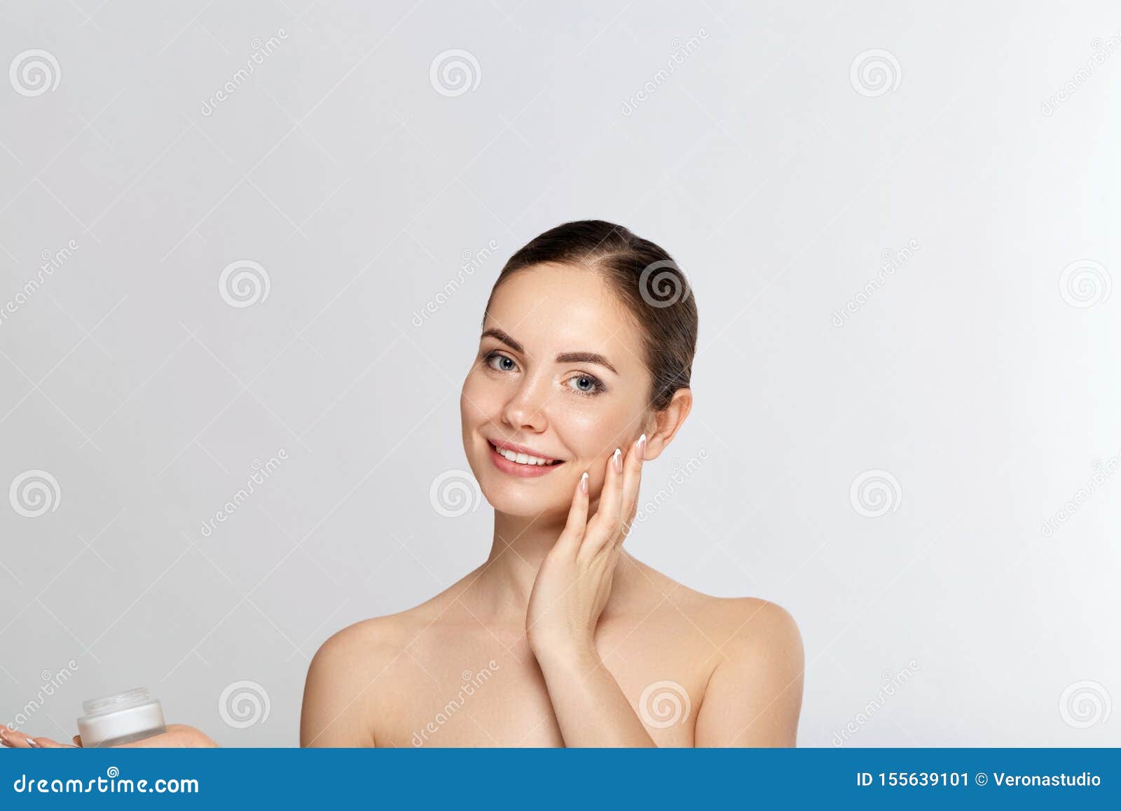 Beauty Woman Concept Skin Care Portrait Of Female Model Holding And