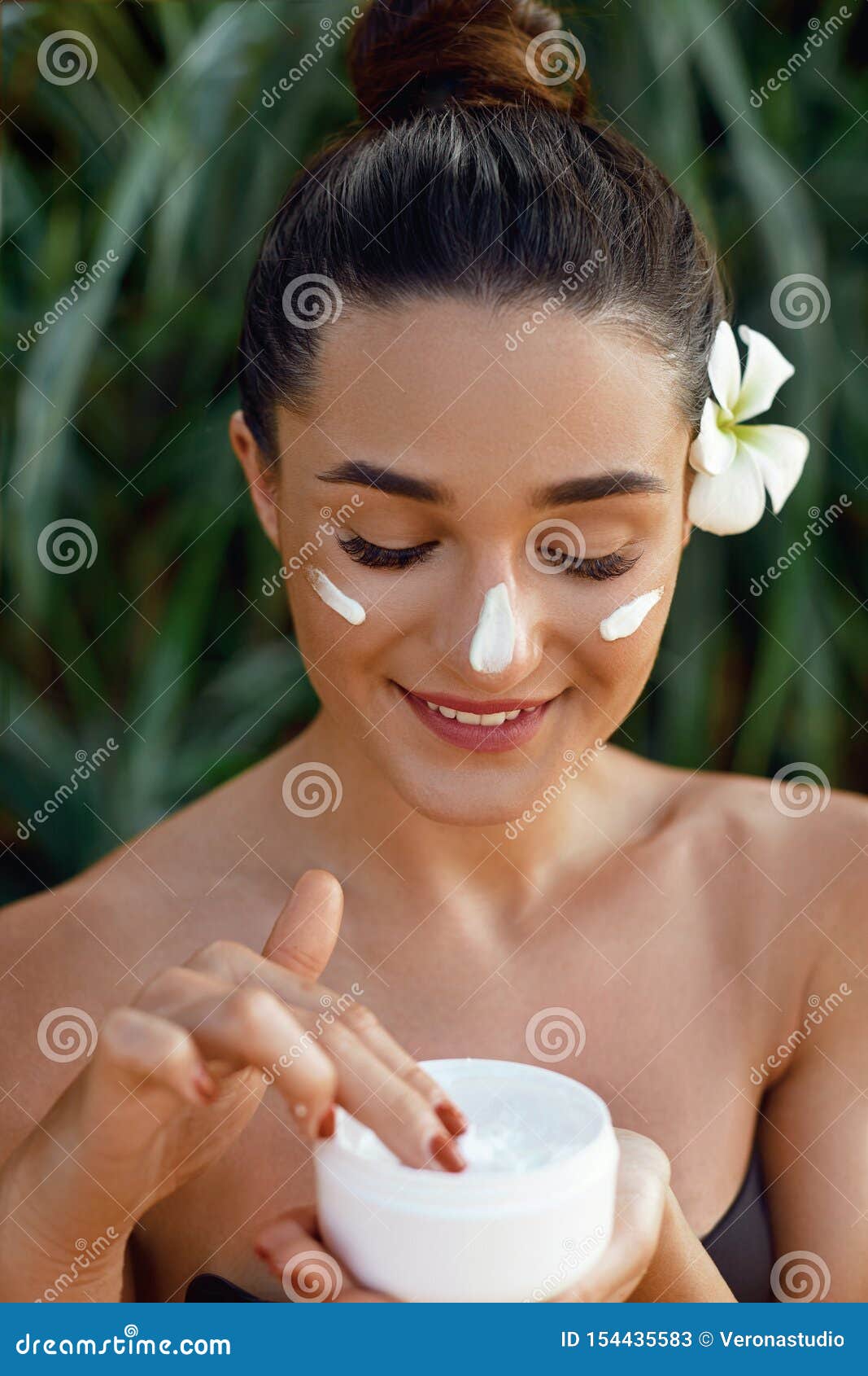 Beauty Woman Concept Skin Care Portrait Of Female Model Holding And