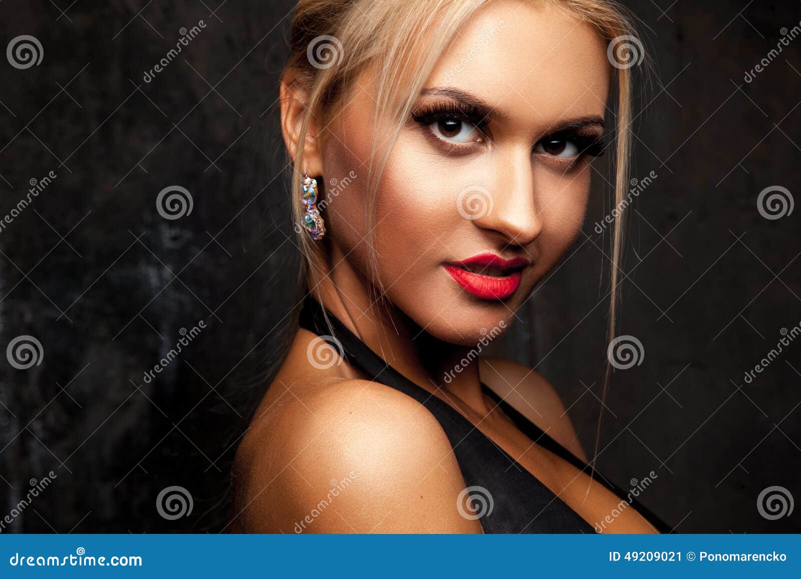 Beauty Woman Looking at Camera with Professional Make Up in Stud Stock ...