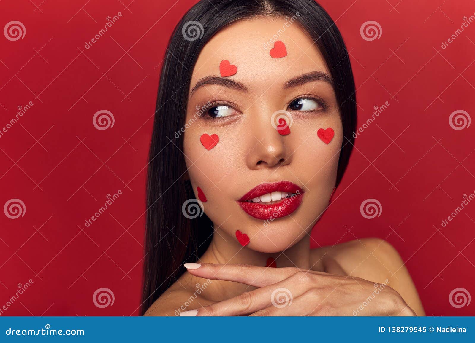 Beauty Woman With Perfect Make Up Hearts On Face Valentine`s Day