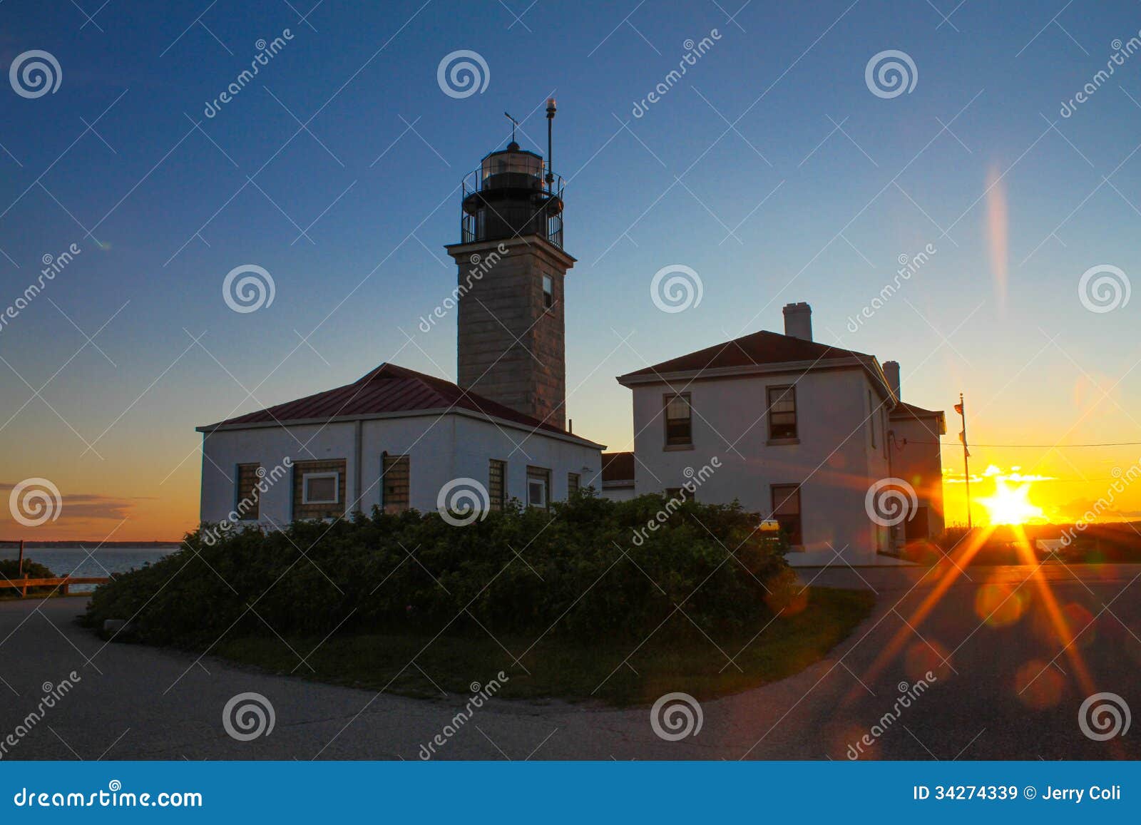 Beavertail Lighthouse stock image. Image of clouds, sunset - 34274339