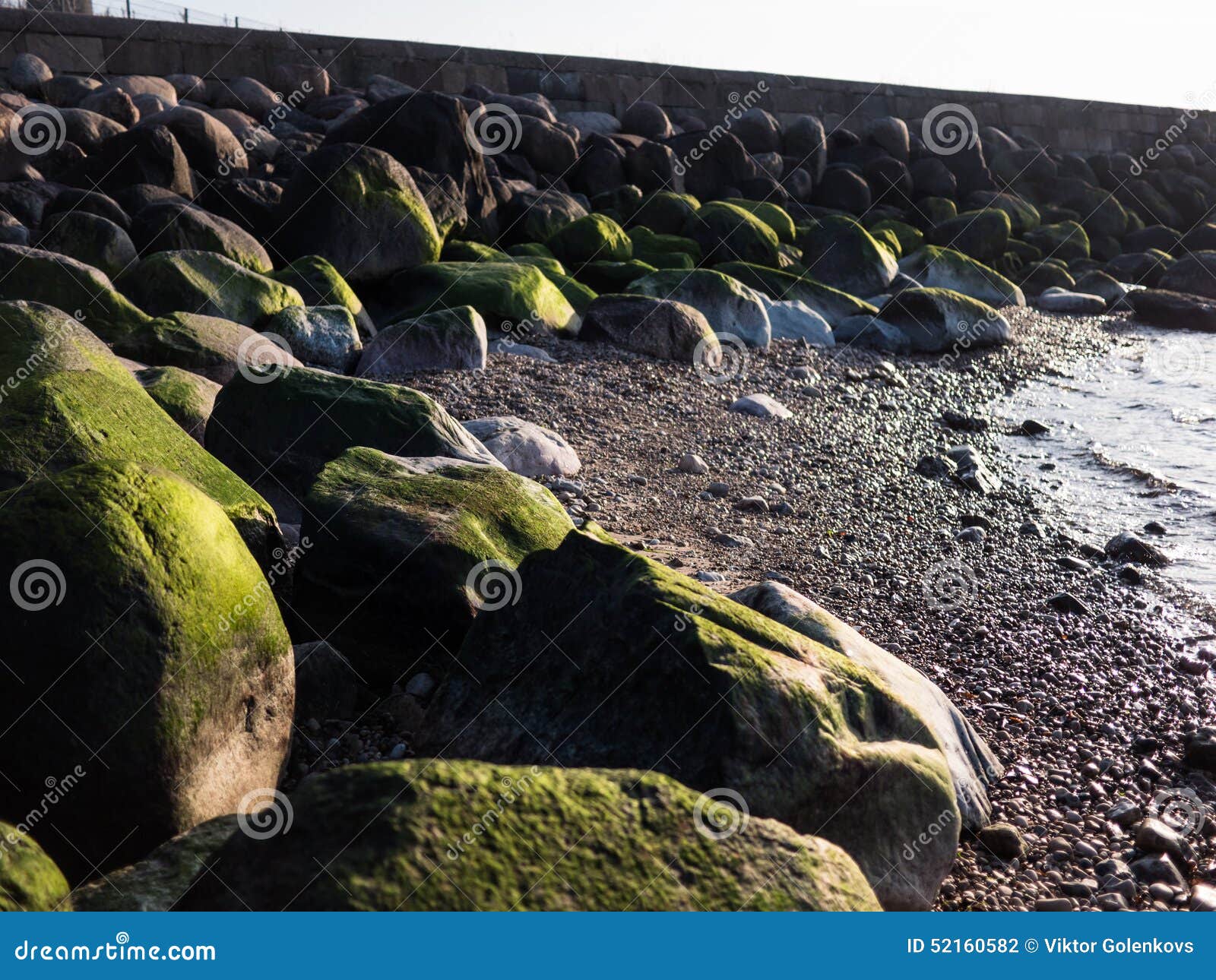 Bech and Stone Near the Ocean Stock Photo - Image of sand, morning ...