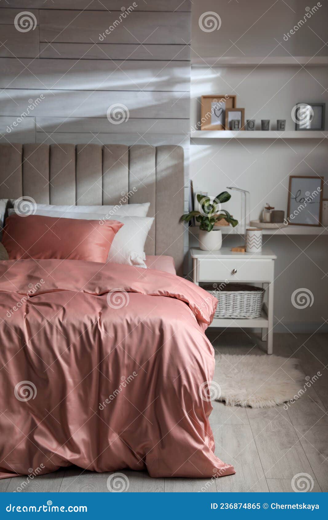 Bed with Beautiful Silky Linens in Stylish Room Interior Stock Image ...