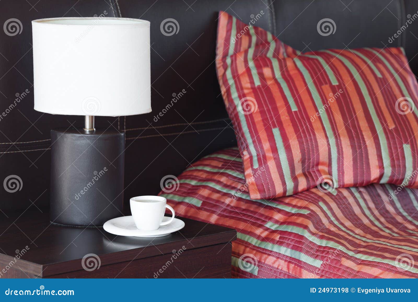 Bed , a Cup of Tea on the Bedside Table and Lamp Stock Photo - Image of ...