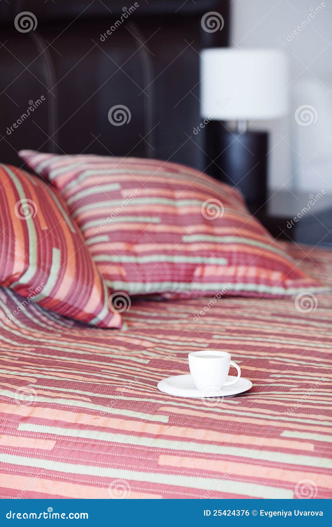 Bed, a Cup of Tea on the Bedside Table and Lamp Stock Photo - Image of ...