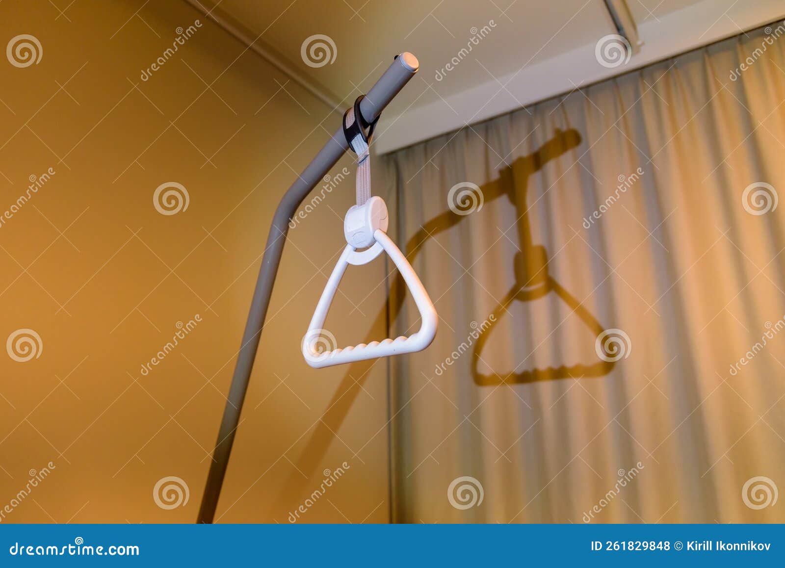 Bed with Hospital Pull-up Device. Brown Curtains Stock Photo - Image of ...