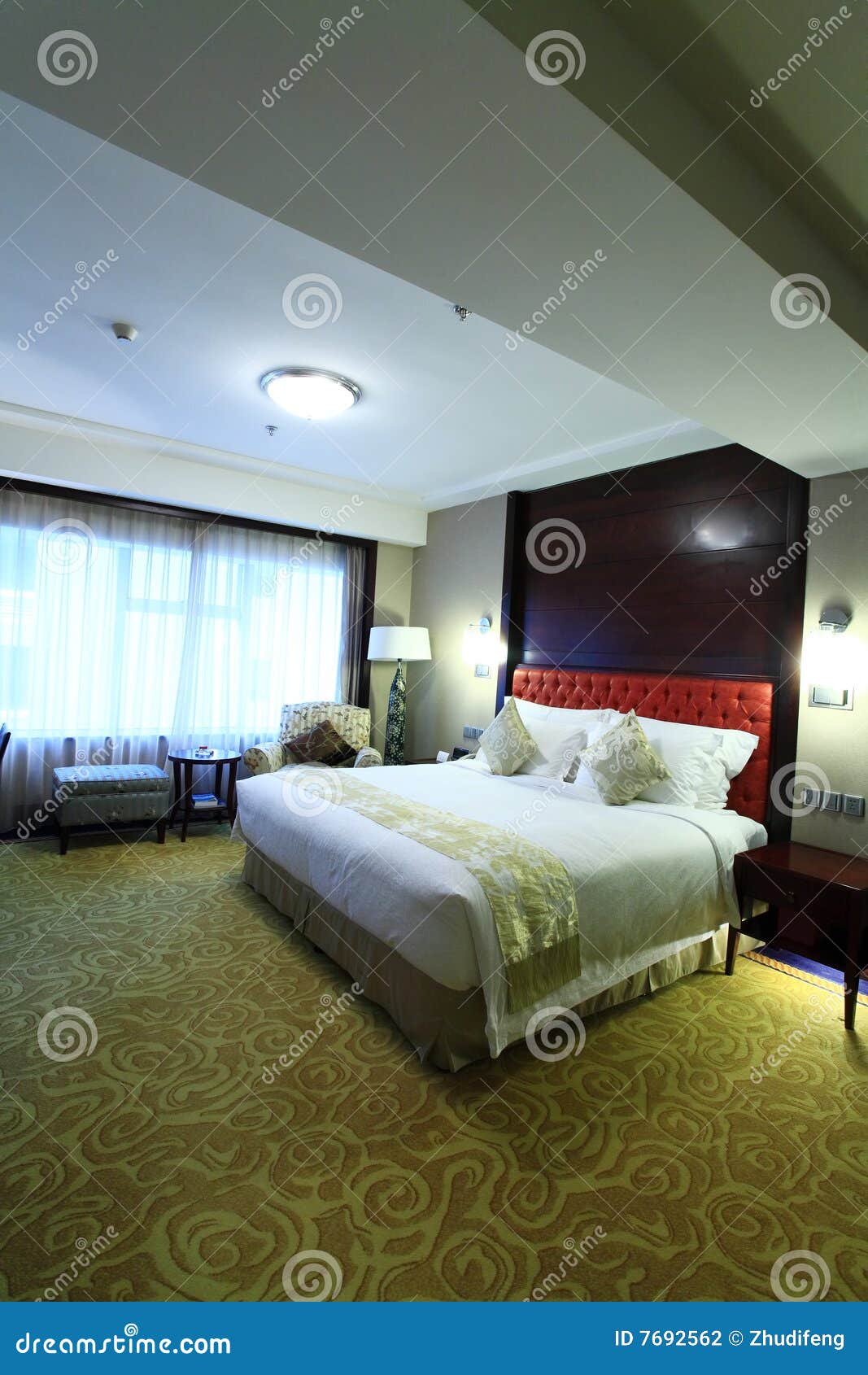 Bed in living room stock photo. Image of home, cushions - 7692562