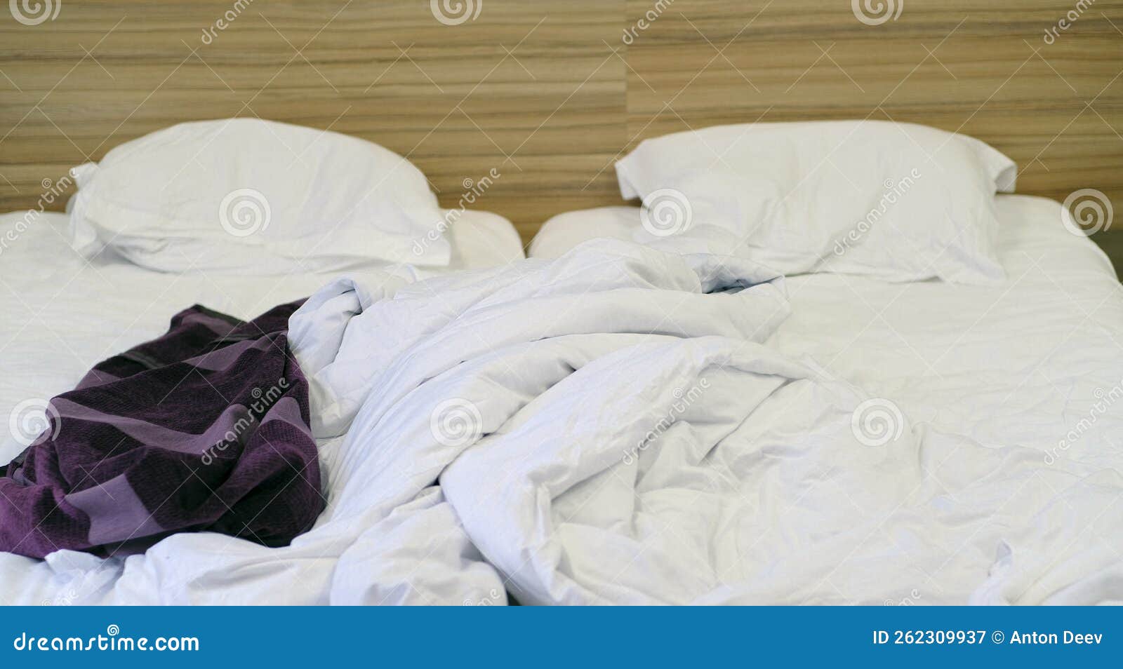 Bed with Pillows and Crumpled Blanket. Crumpled Blanket and Pillows on ...