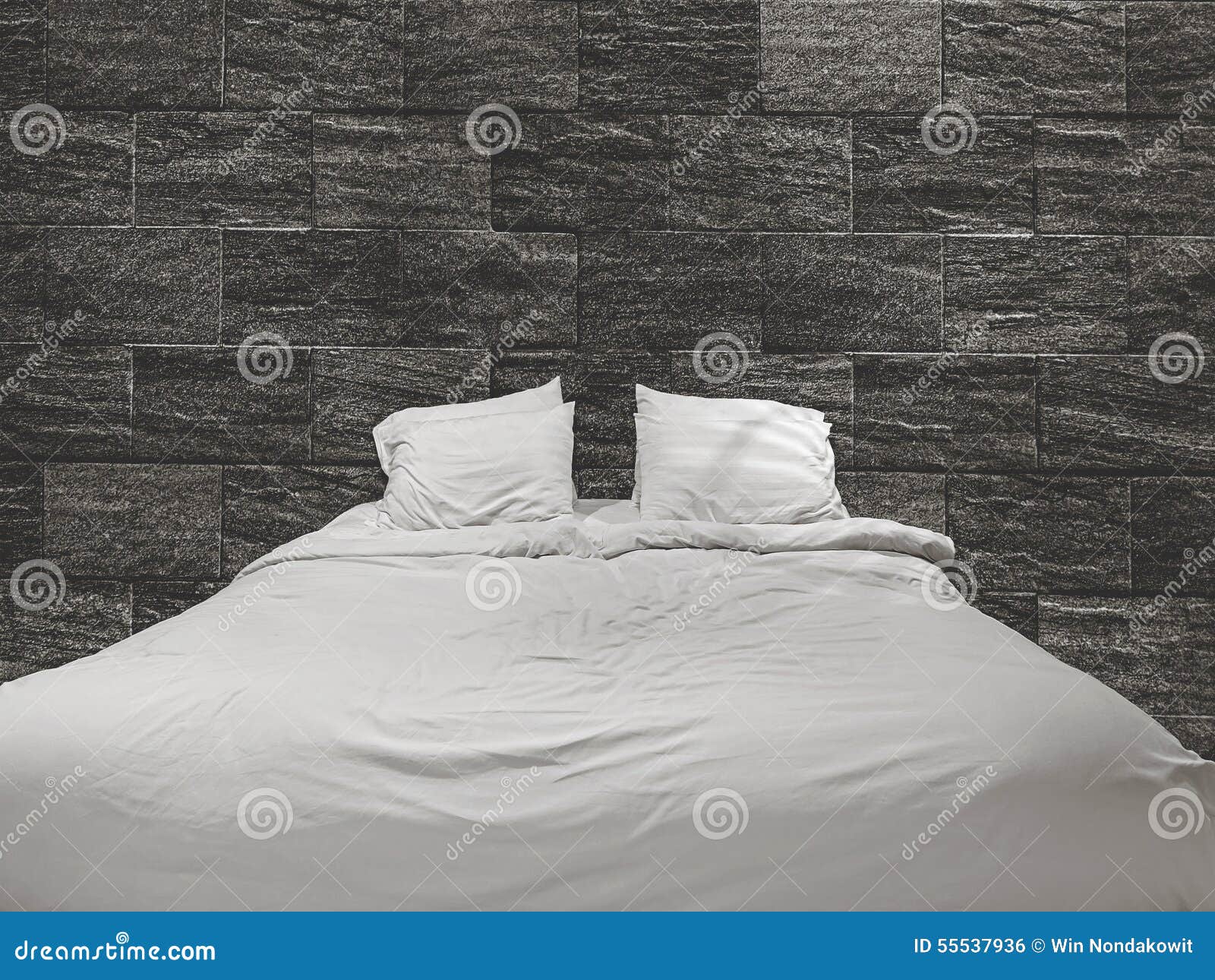 Bed and stone wall stock photo. Image of interior, suite - 55537936