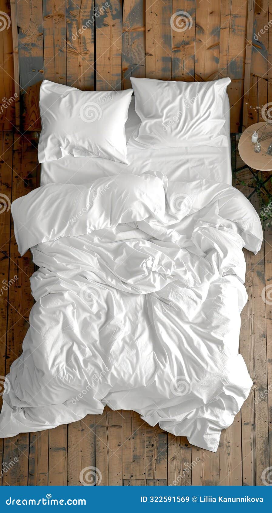 A Bed with White Sheets and Pillows, Emphasizing Its Disheveled State ...