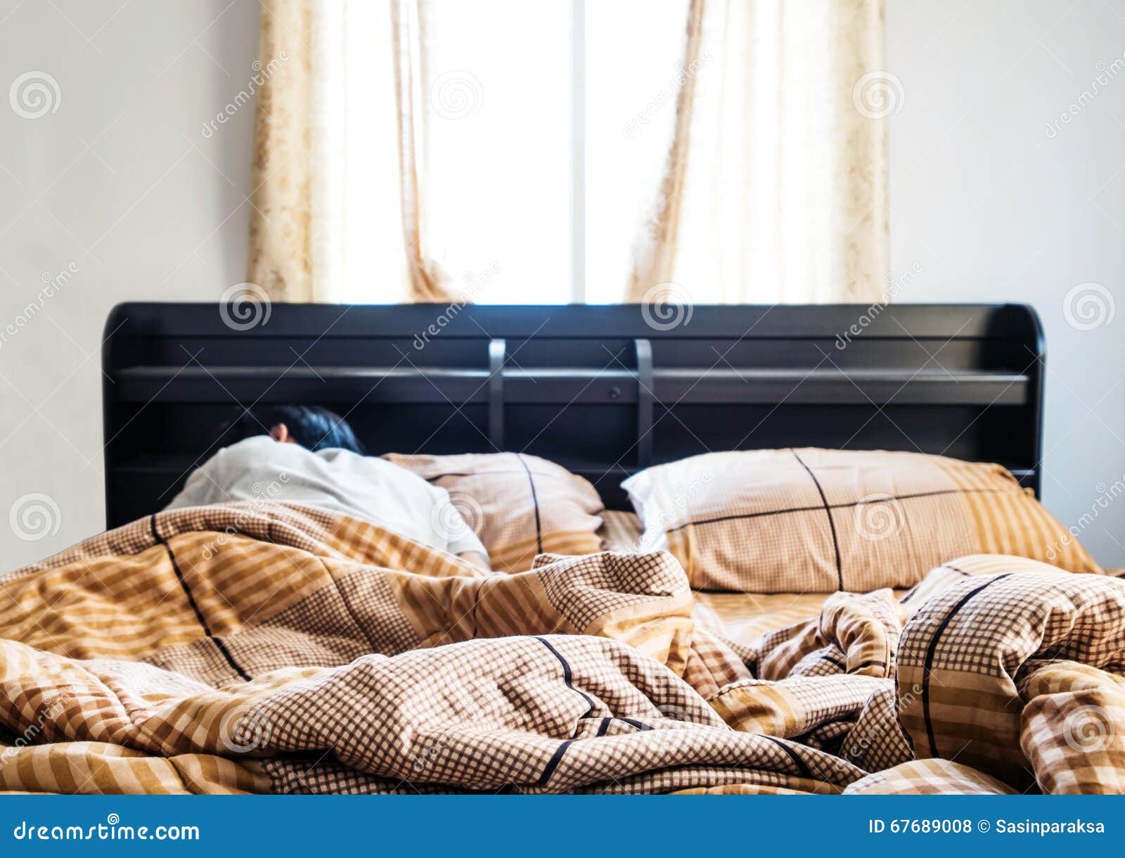 Bed with Window in the Morning with a Guy Sleeping, Selective Focus on ...
