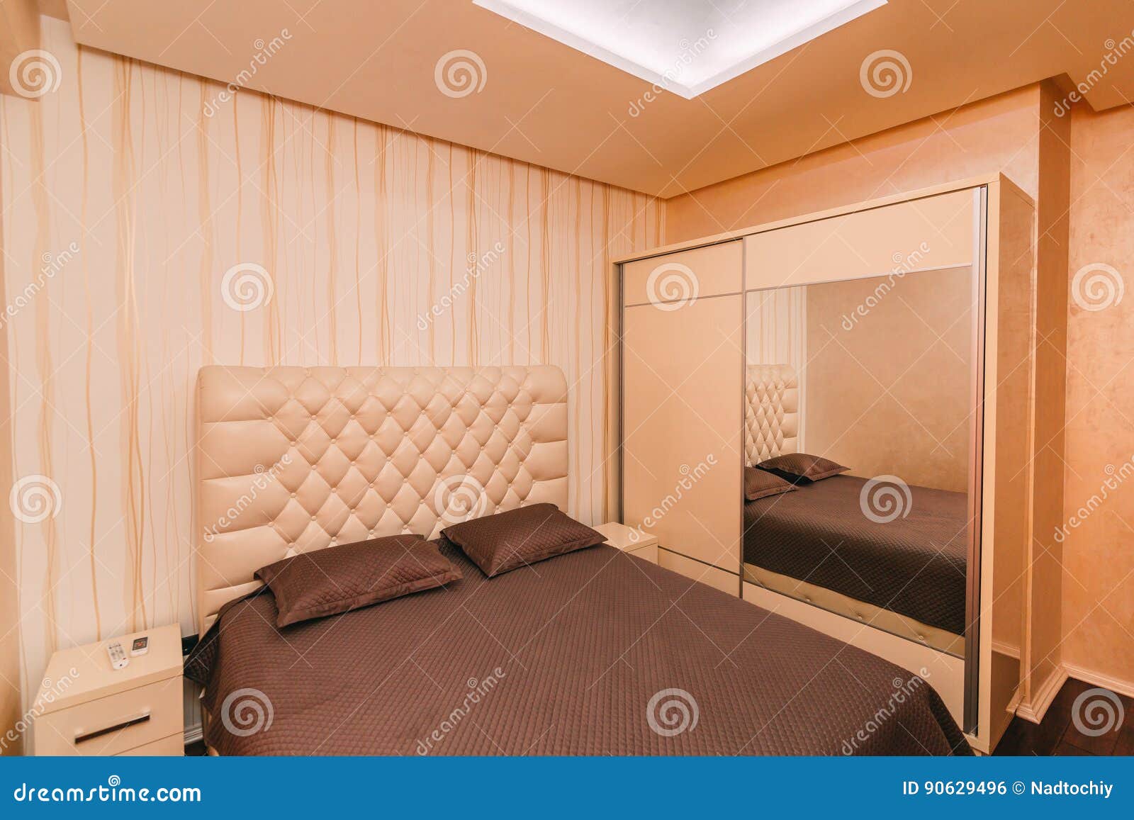 The Bedroom in the Apartment. Bed, Wardrobe, Bedside Tables in T Stock ...