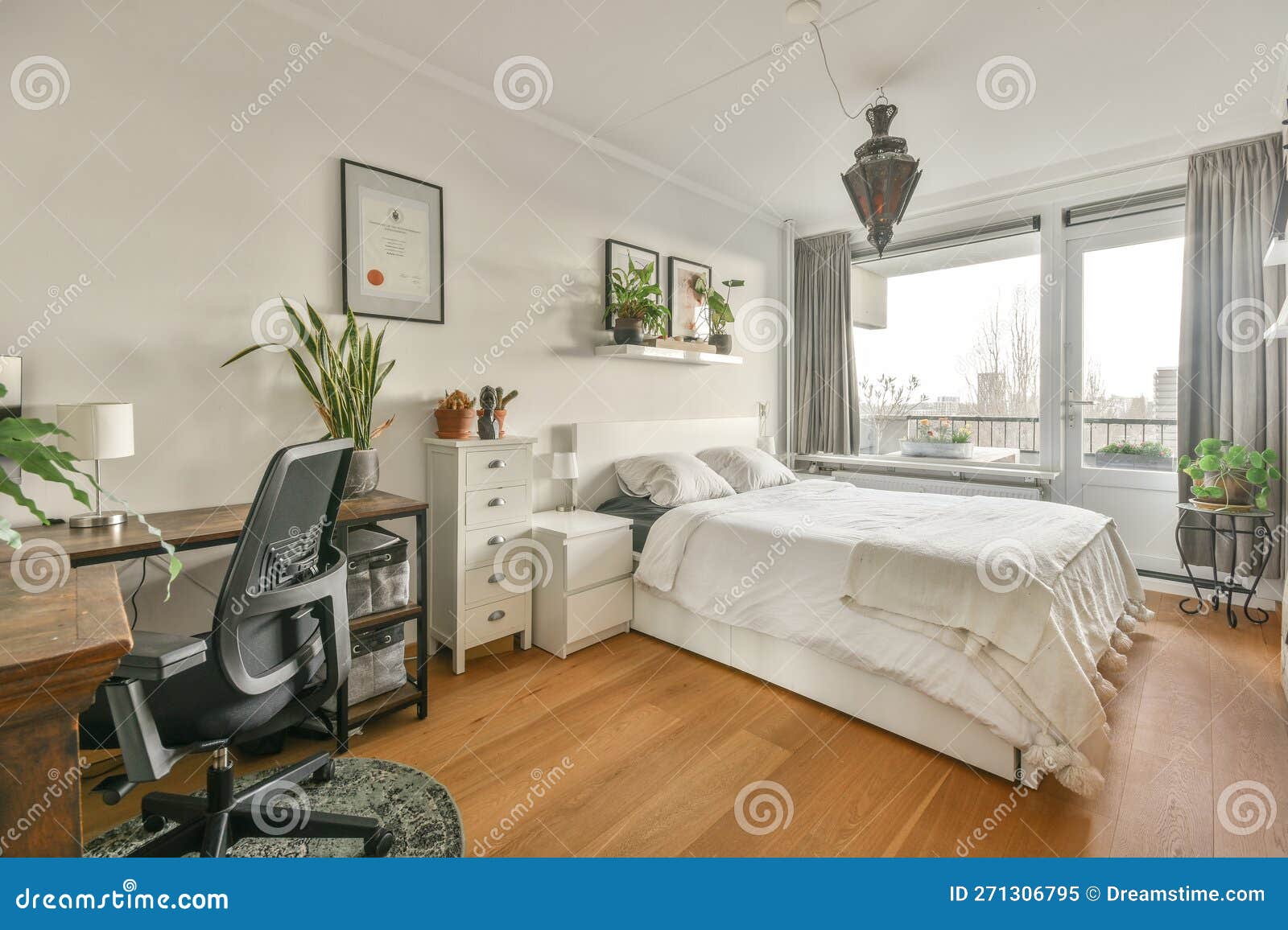 A Bedroom with a Bed and a Desk and Windows Editorial Image - Image of ...
