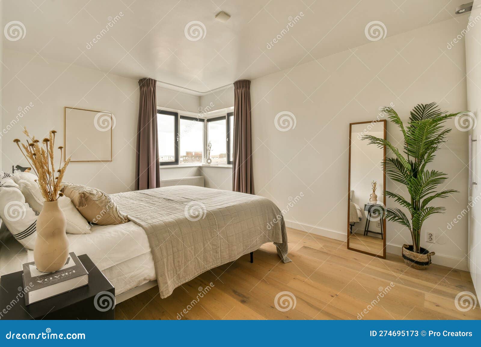 A Bedroom with a Bed and a Mirror and a Stock Image - Image of modern ...