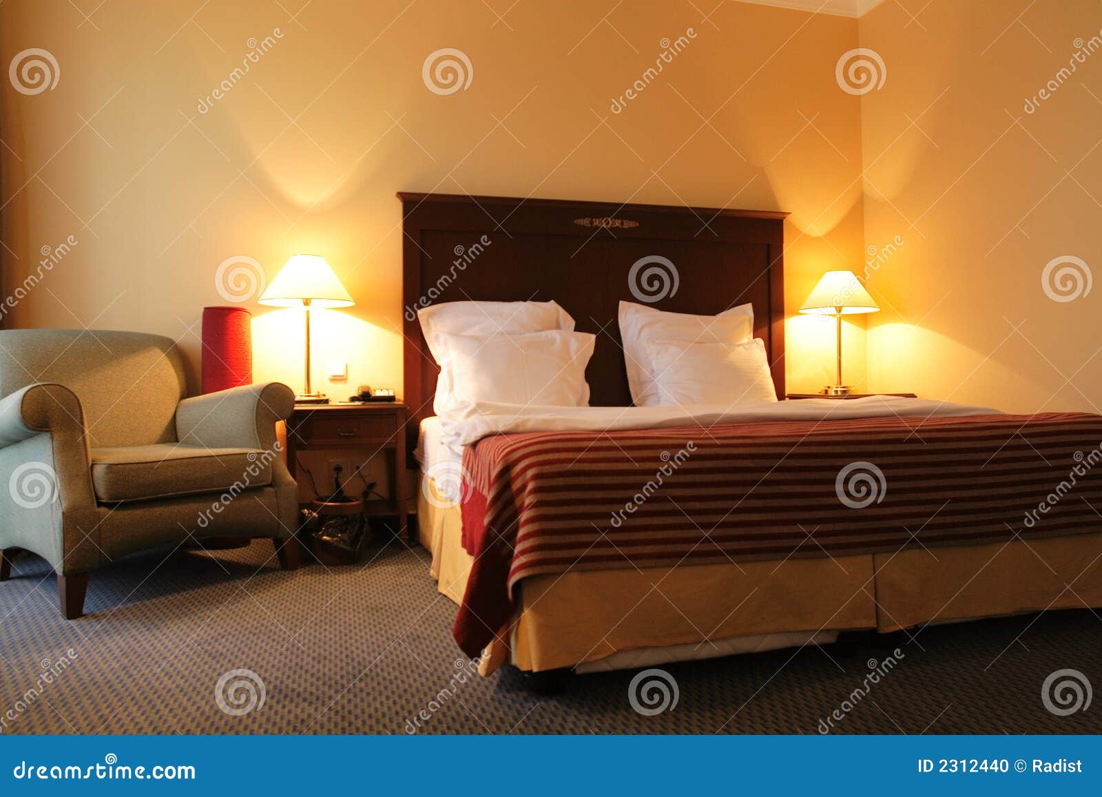 Bedroom in the evening stock photo. Image of linens, lighting - 2312440