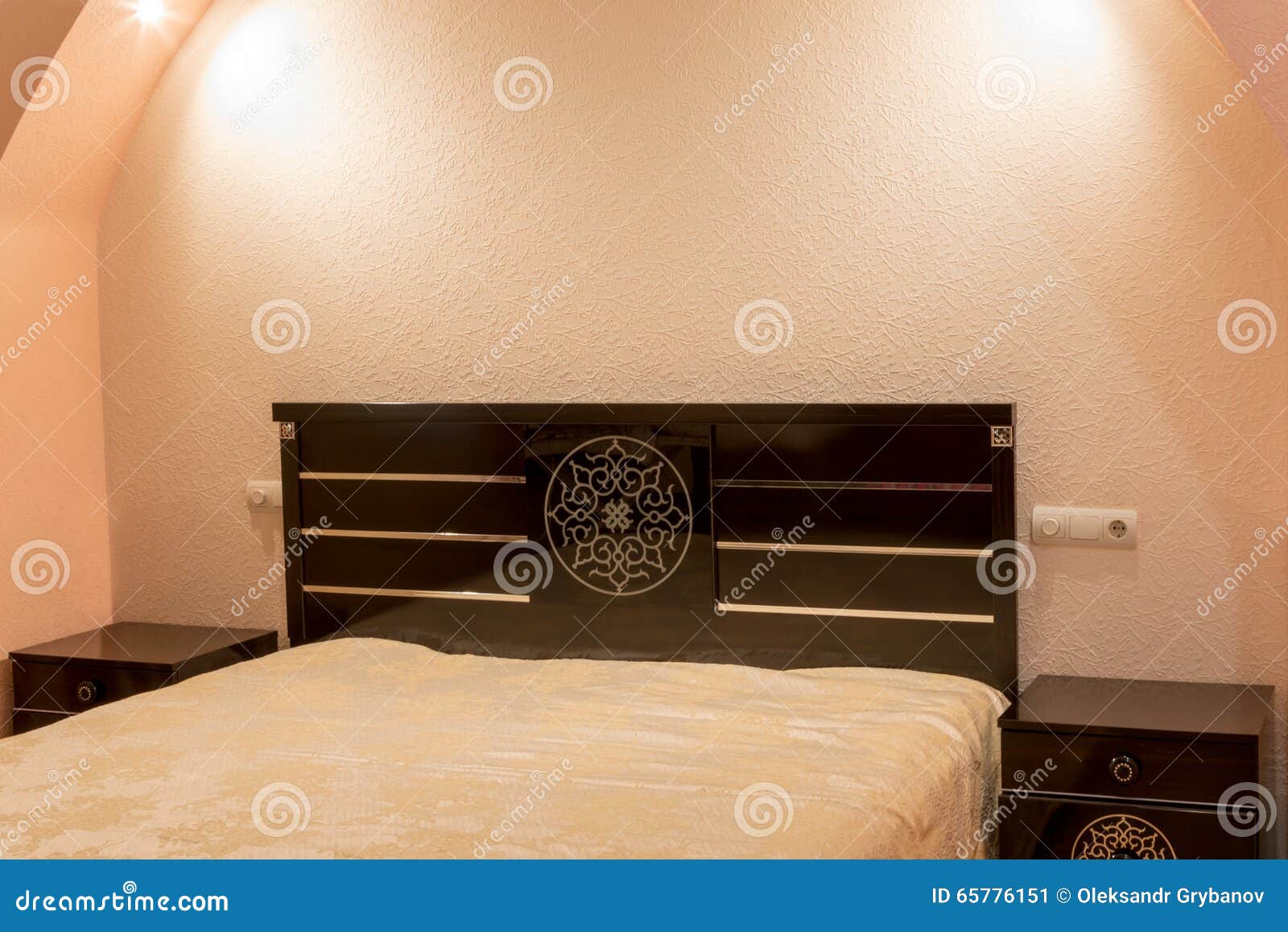Bedside table near the bed stock image. Image of furniture - 65776151