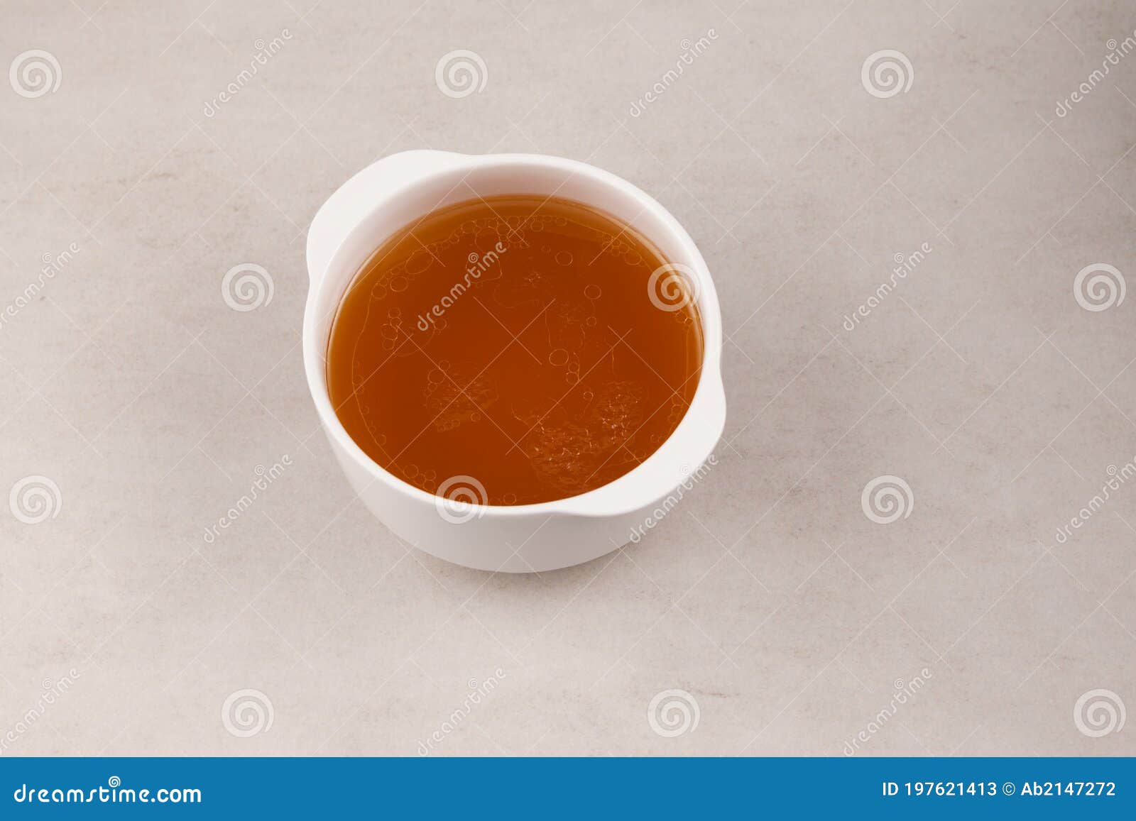 Beef Bone Broth in White Bowl on a Stone Surface. Healthy Beverage with ...