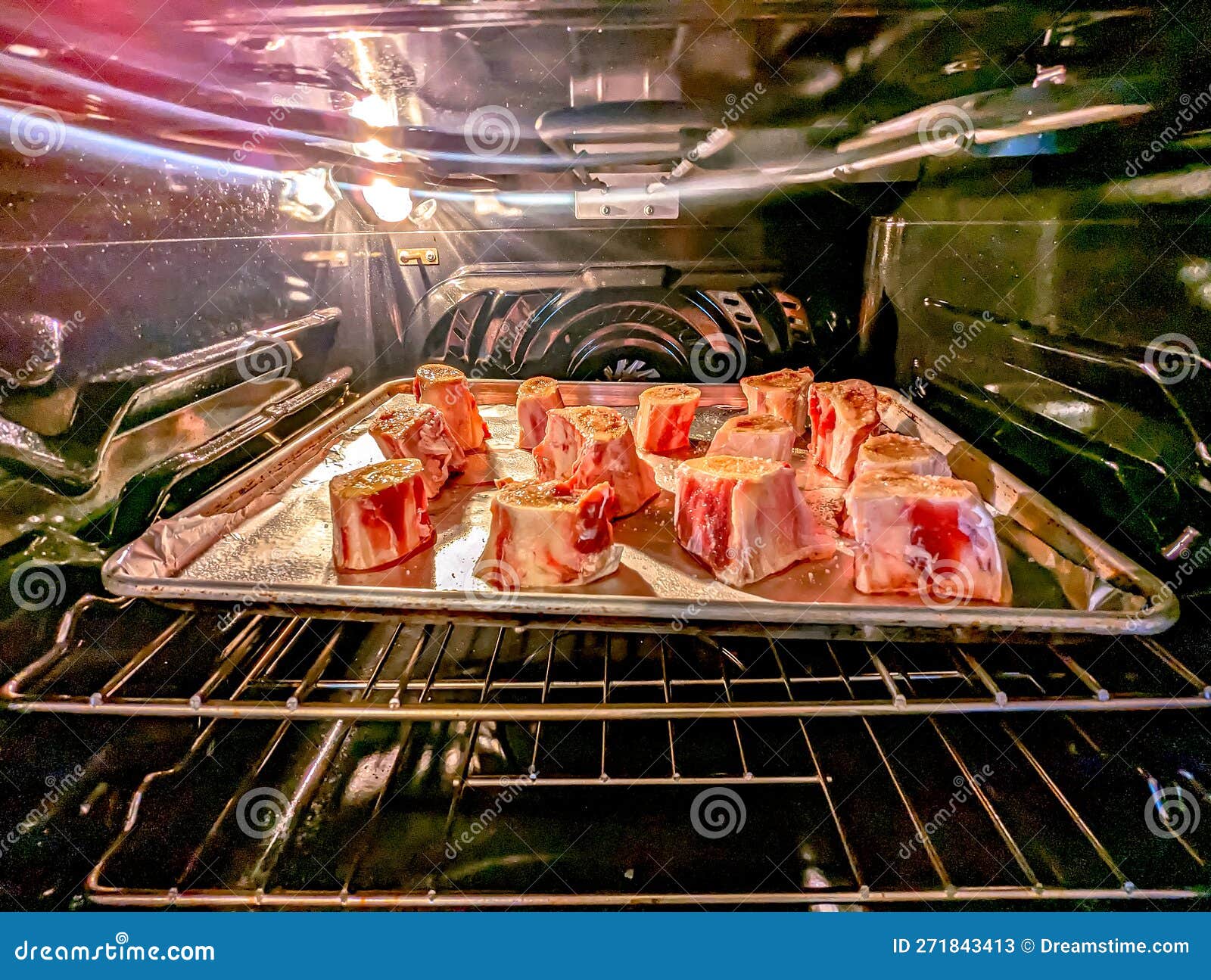 Beef Bone Marrow Pieces in the Oven on a Tray Ready for a Meal Stock ...