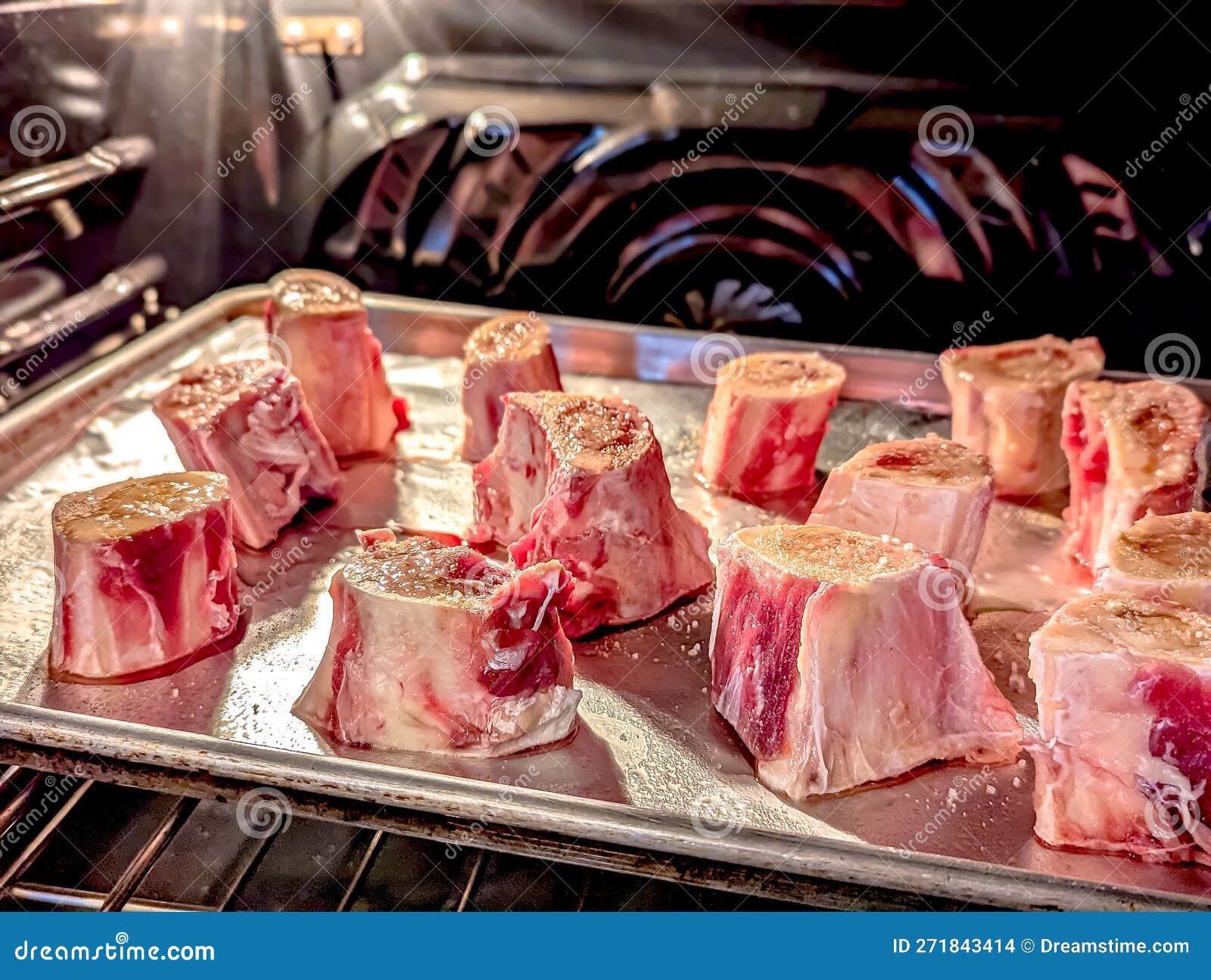 Beef Bone Marrow Pieces in the Oven on a Tray Ready for a Meal Stock ...