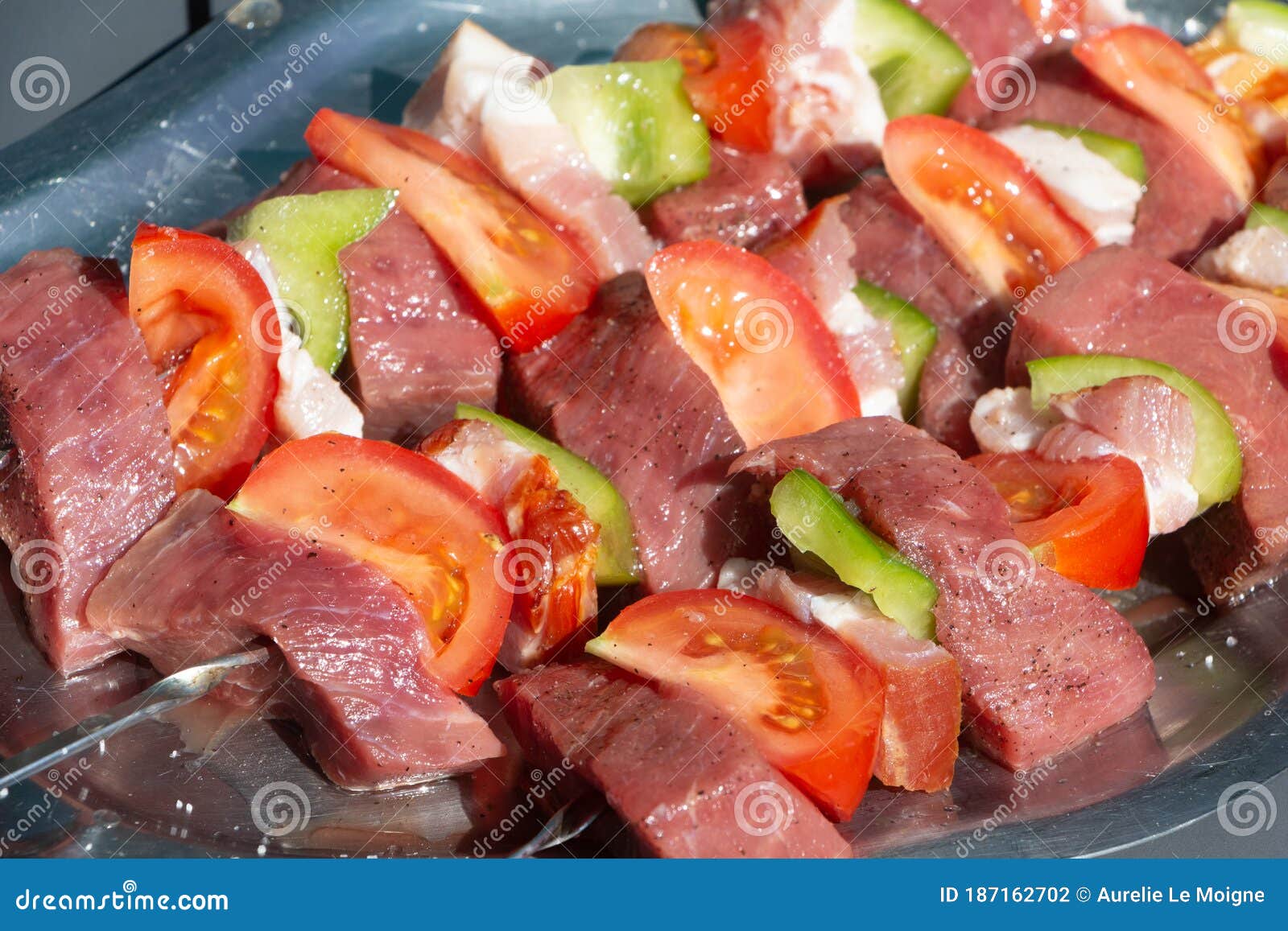 Beef brochettes on a dish stock photo. Image of food - 187162702