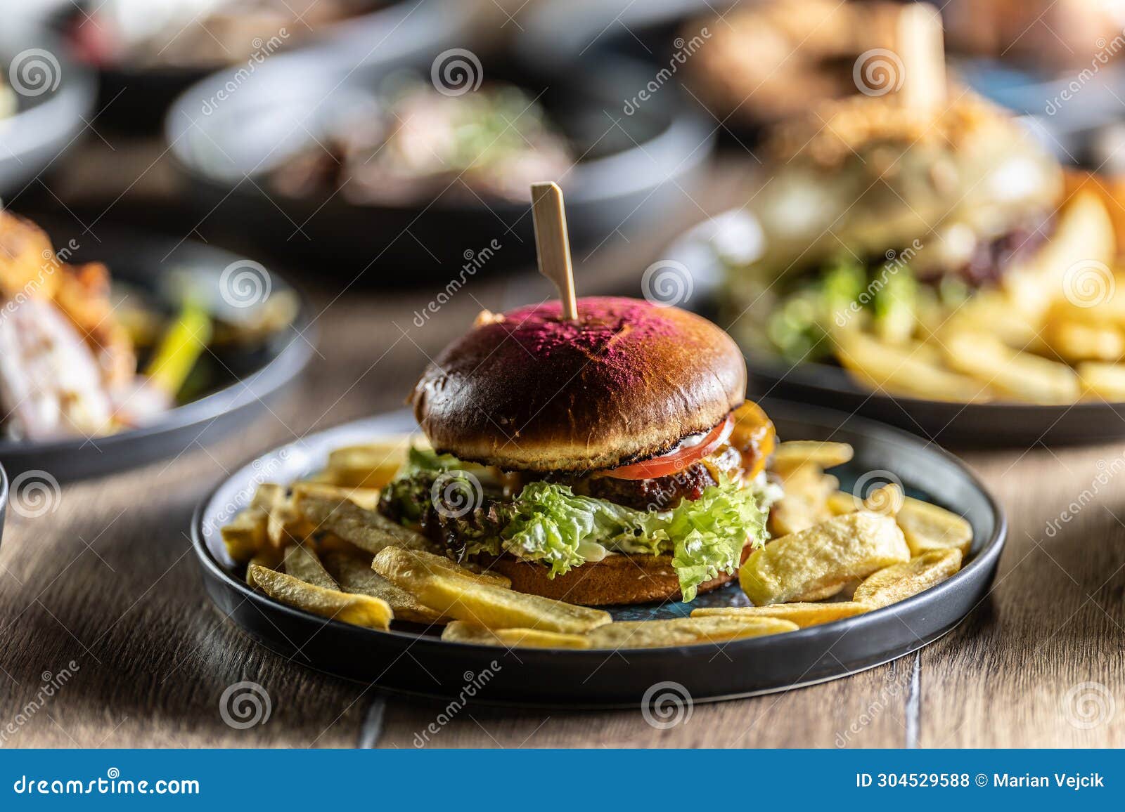 Beef Burger with Fries and Draft Beer on a Pub or Restaurant Plate ...