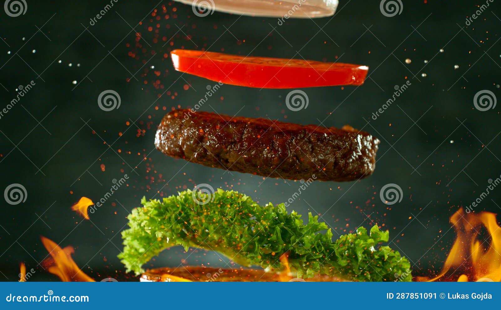 Beef Burger with Ingredients Falling Stock Image - Image of cheese ...