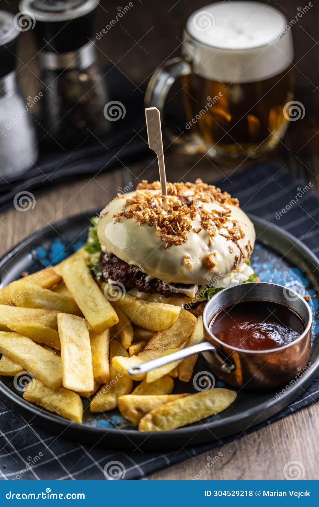 Beef Burger Topped with Cheese with Fries and Draft Beer on a Pub or ...
