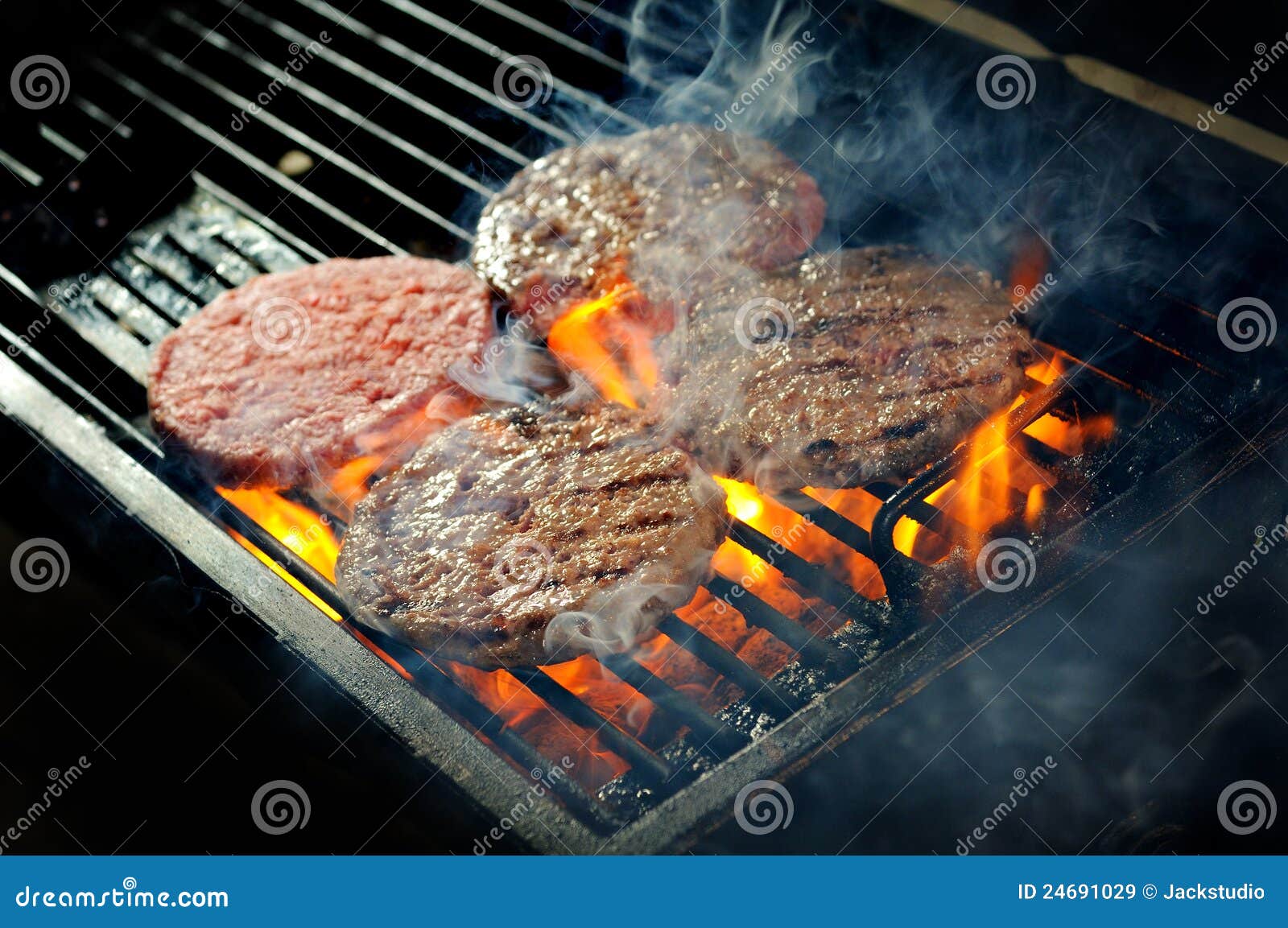 Beef burgers being cooked stock image. Image of grilled - 24691029