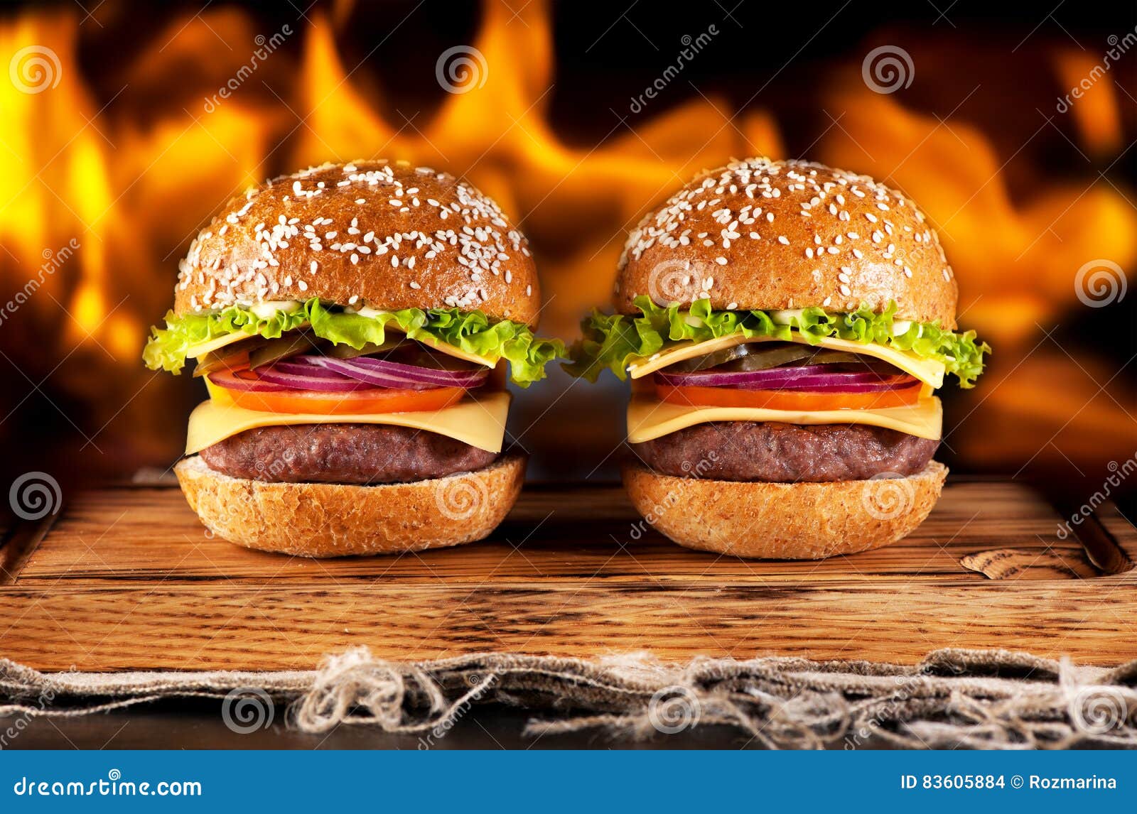 Beef Burgers with Vegetables and Cheese are Burning in Fire Stock Photo ...