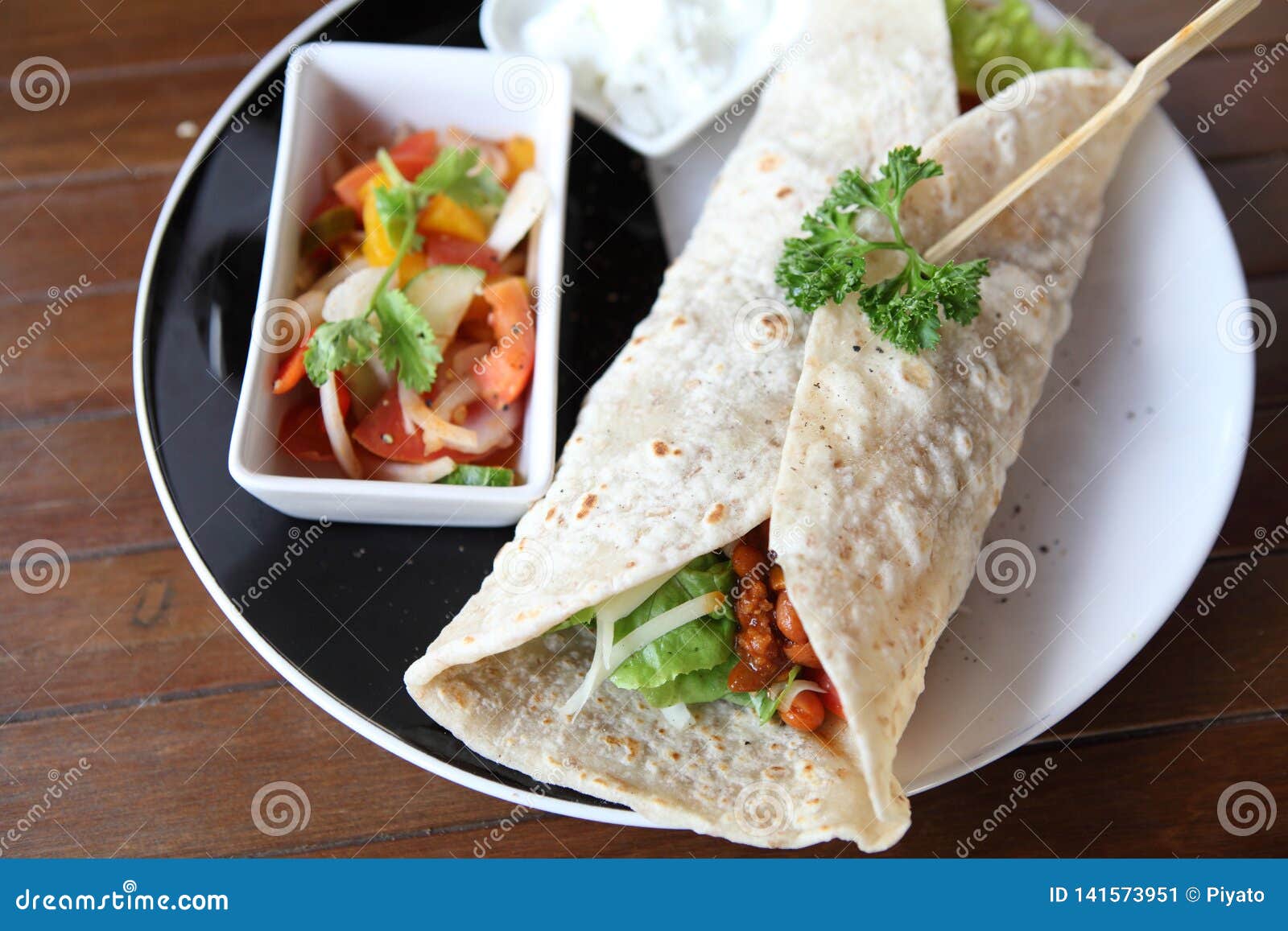 Beef burritos on a plate stock image. Image of meat - 141573951